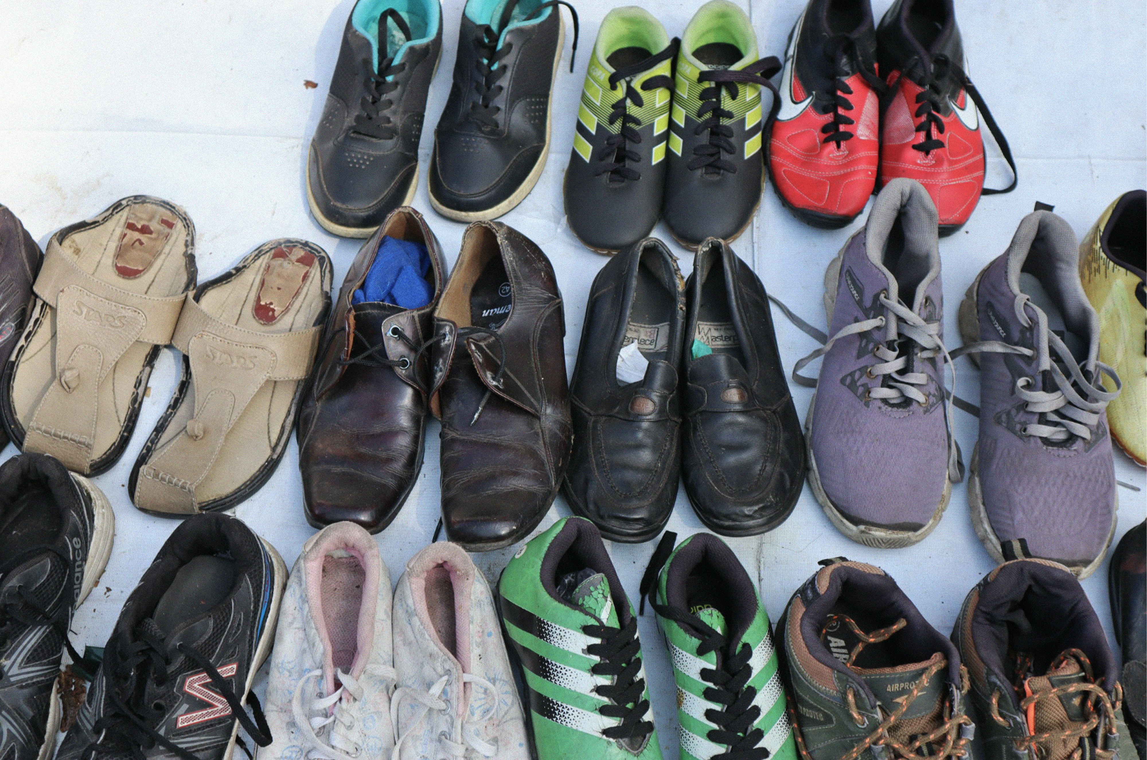 A bunch of shoes that are lined up together photo – Free Shoes Image on ...