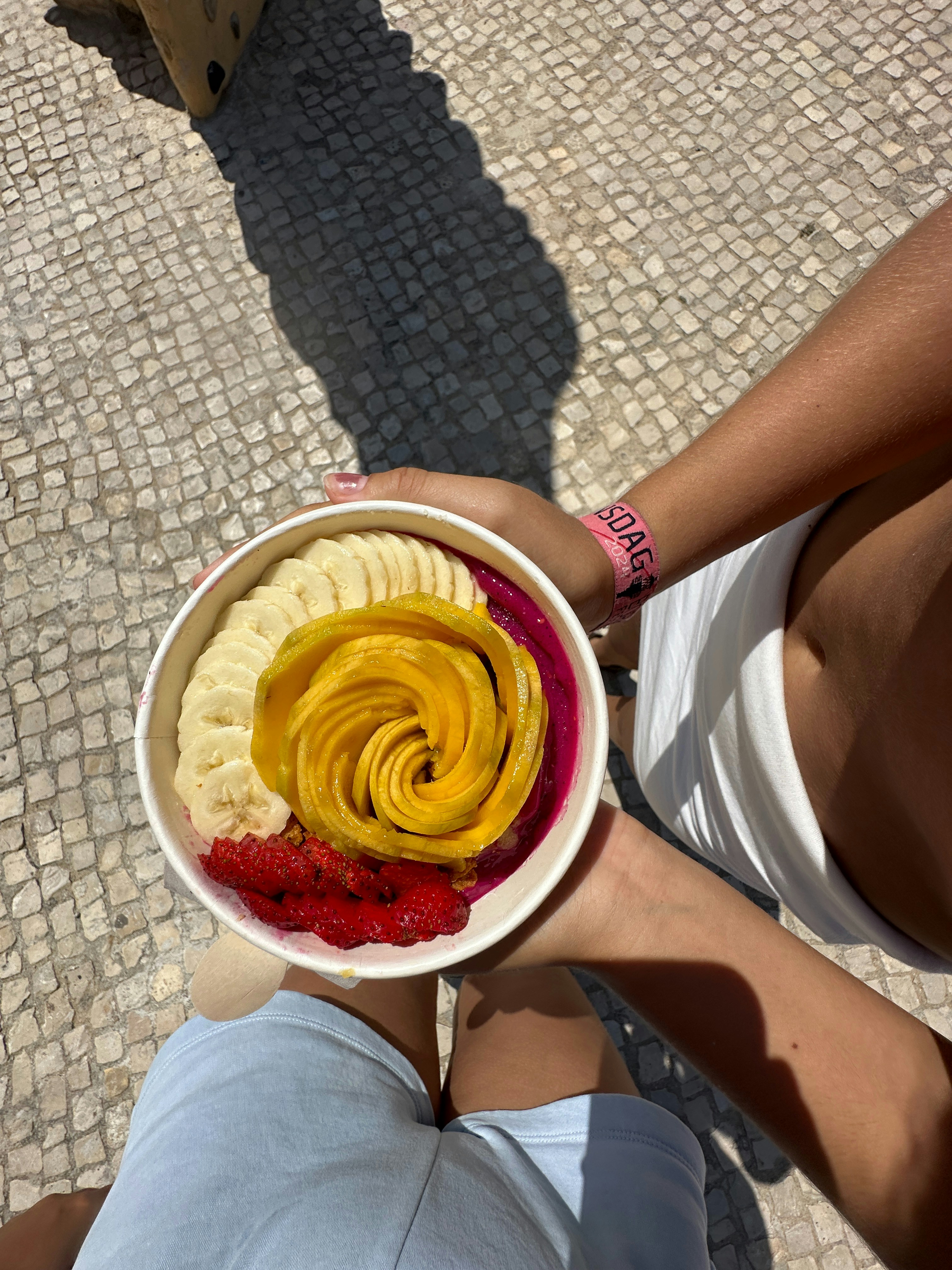 Mango Rose Bowl on Sunlit Cobblestones