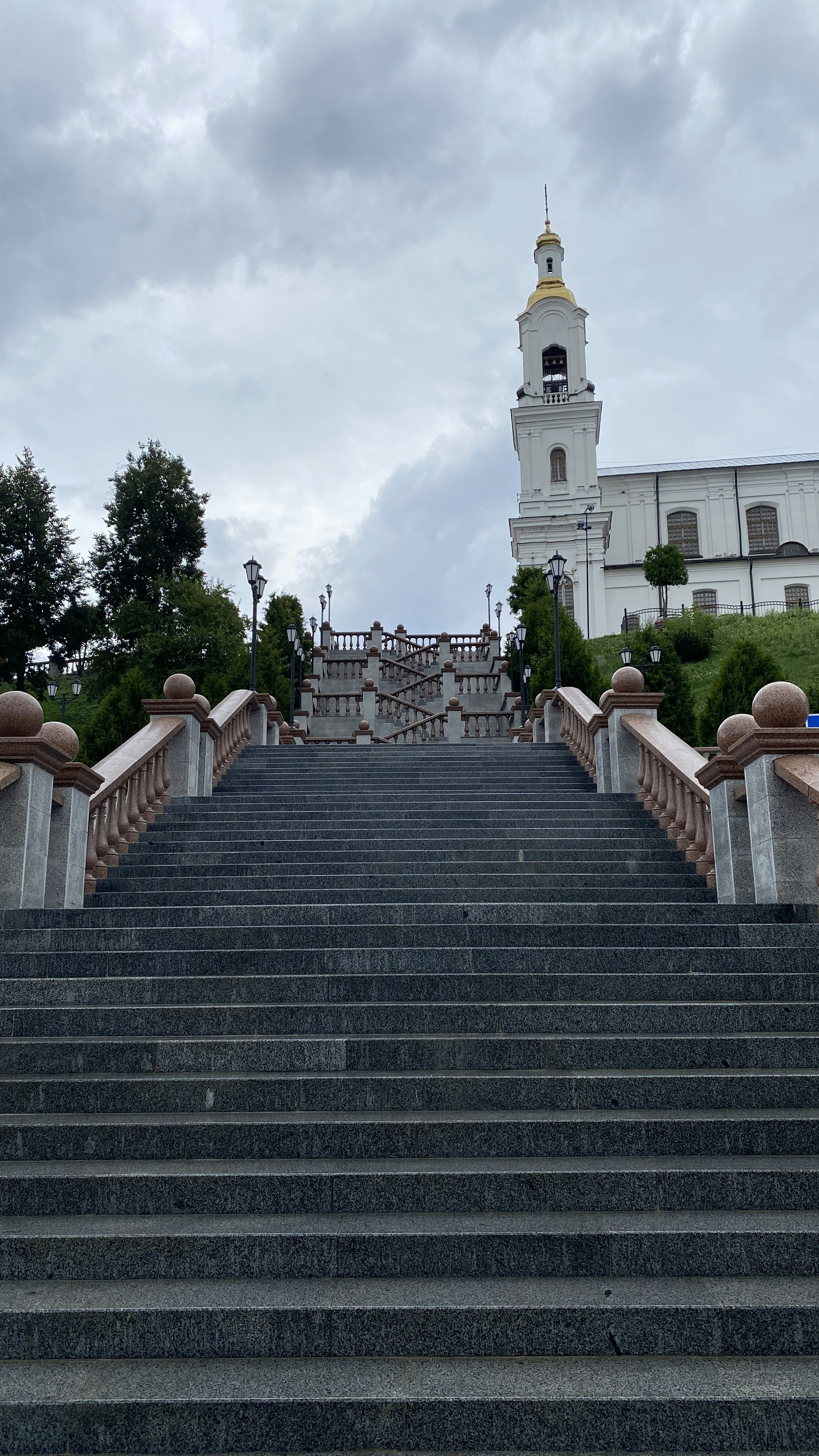 Staircase to the Bell Tower: symmetry beneath a cloudy sky