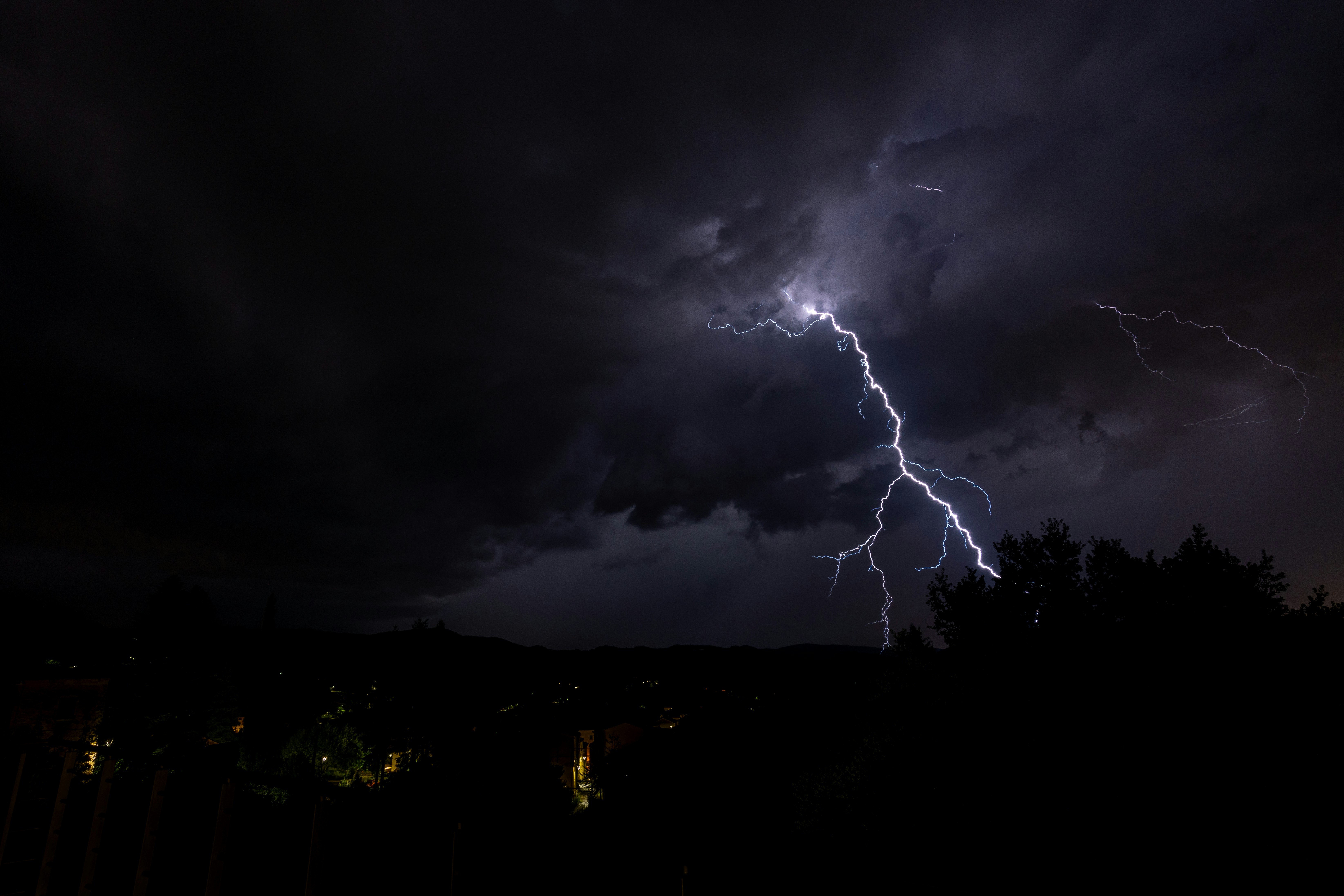 A lightning bolt is seen in the night sky photo – Free Night Image on ...