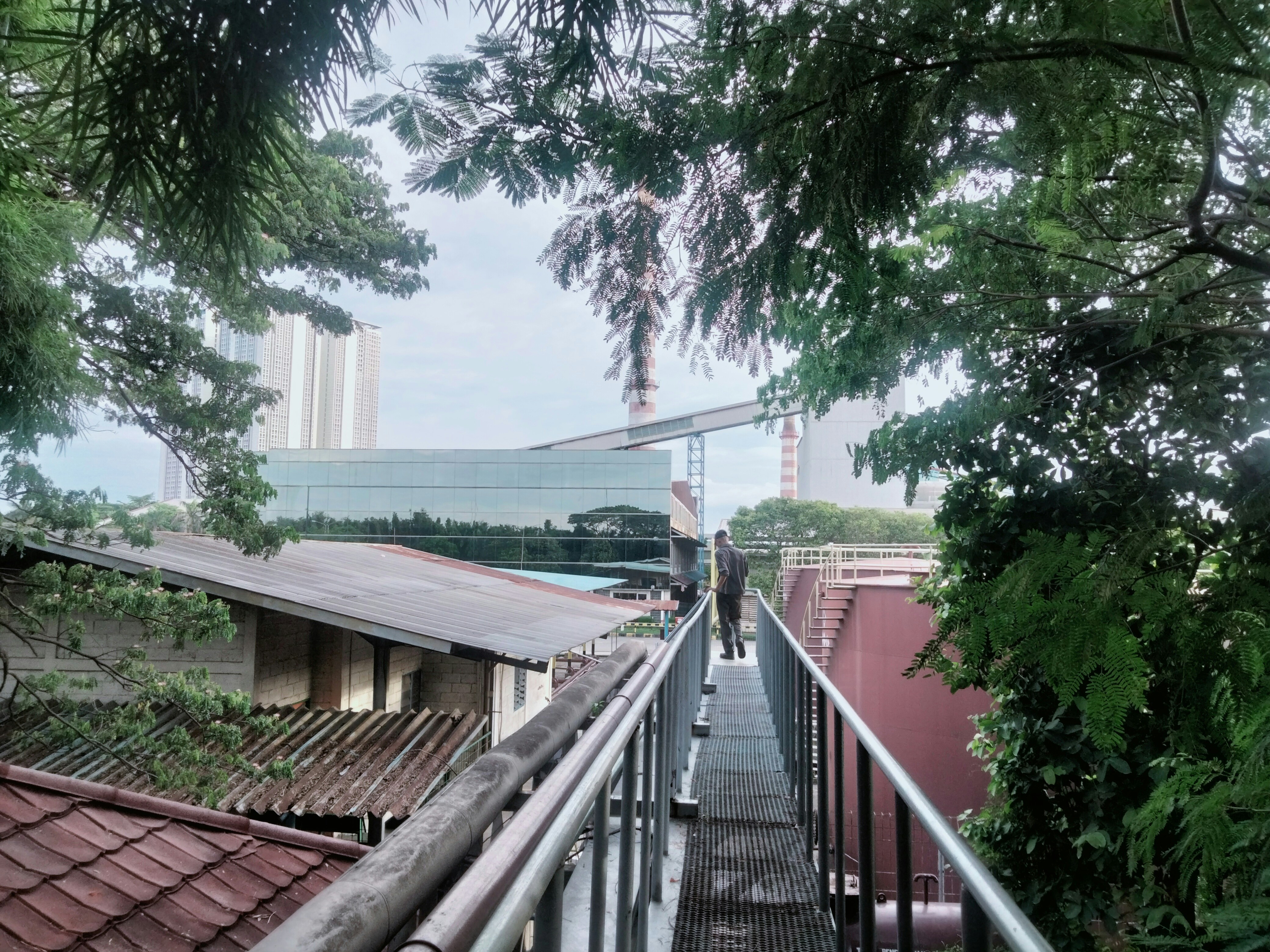 A man walking down a set of stairs photo – Free Cikarang selatan Image ...