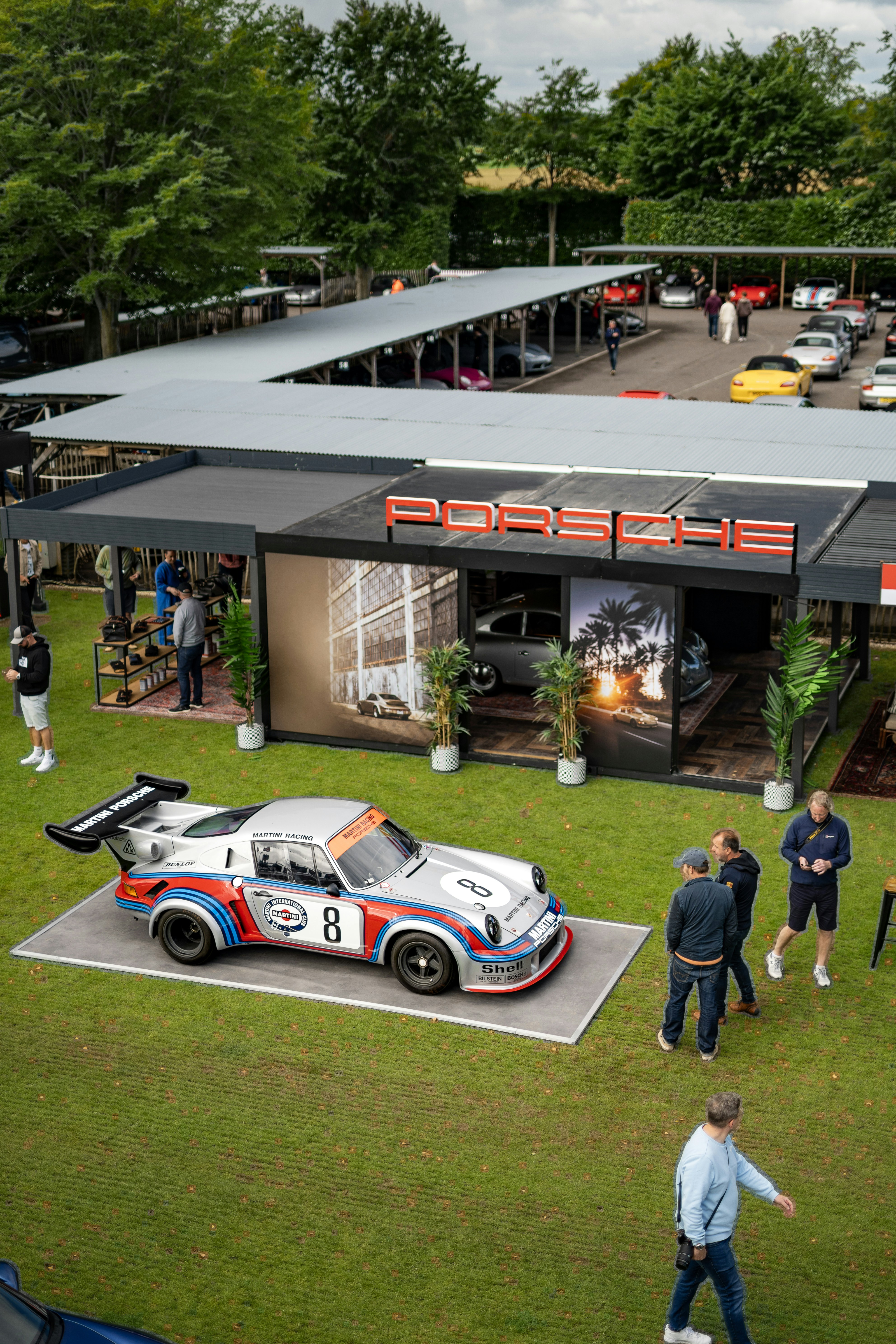 A group of people standing around a car show photo – Free Gt4rs Image ...