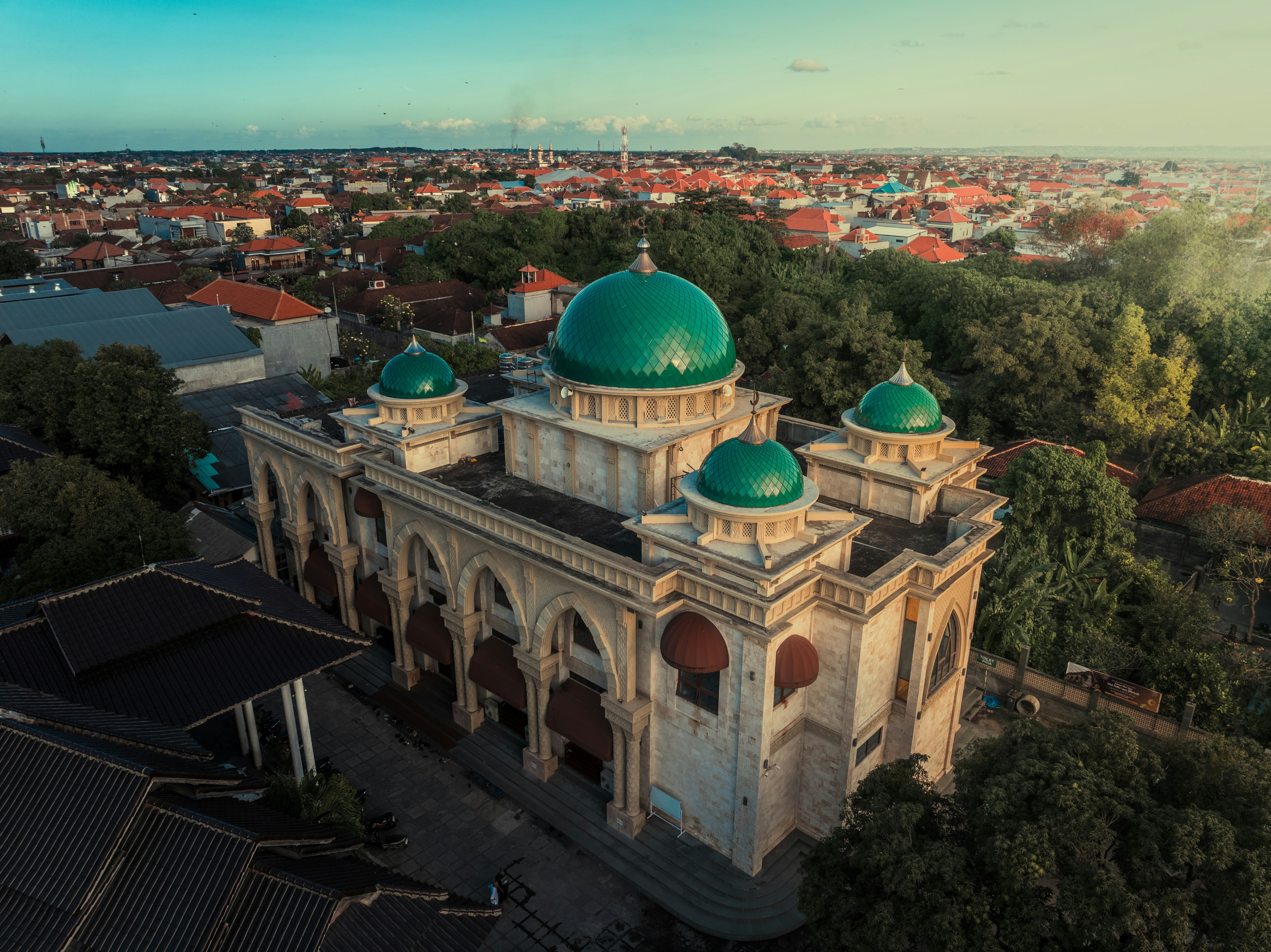 An aerial view of a building with green domes photo – Free Building ...