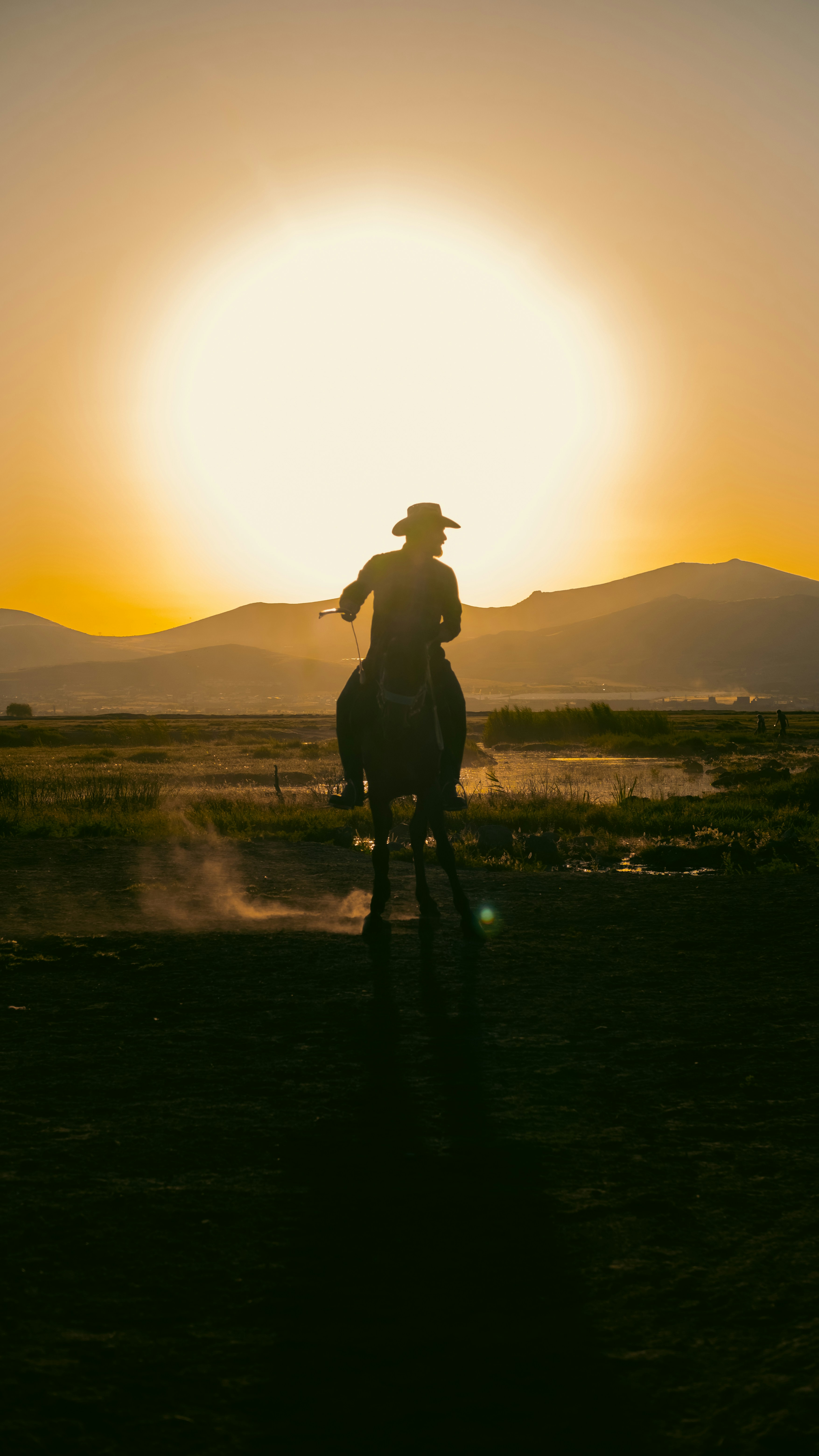 A person riding a horse in the middle of a field photo – Free Kayseri ...