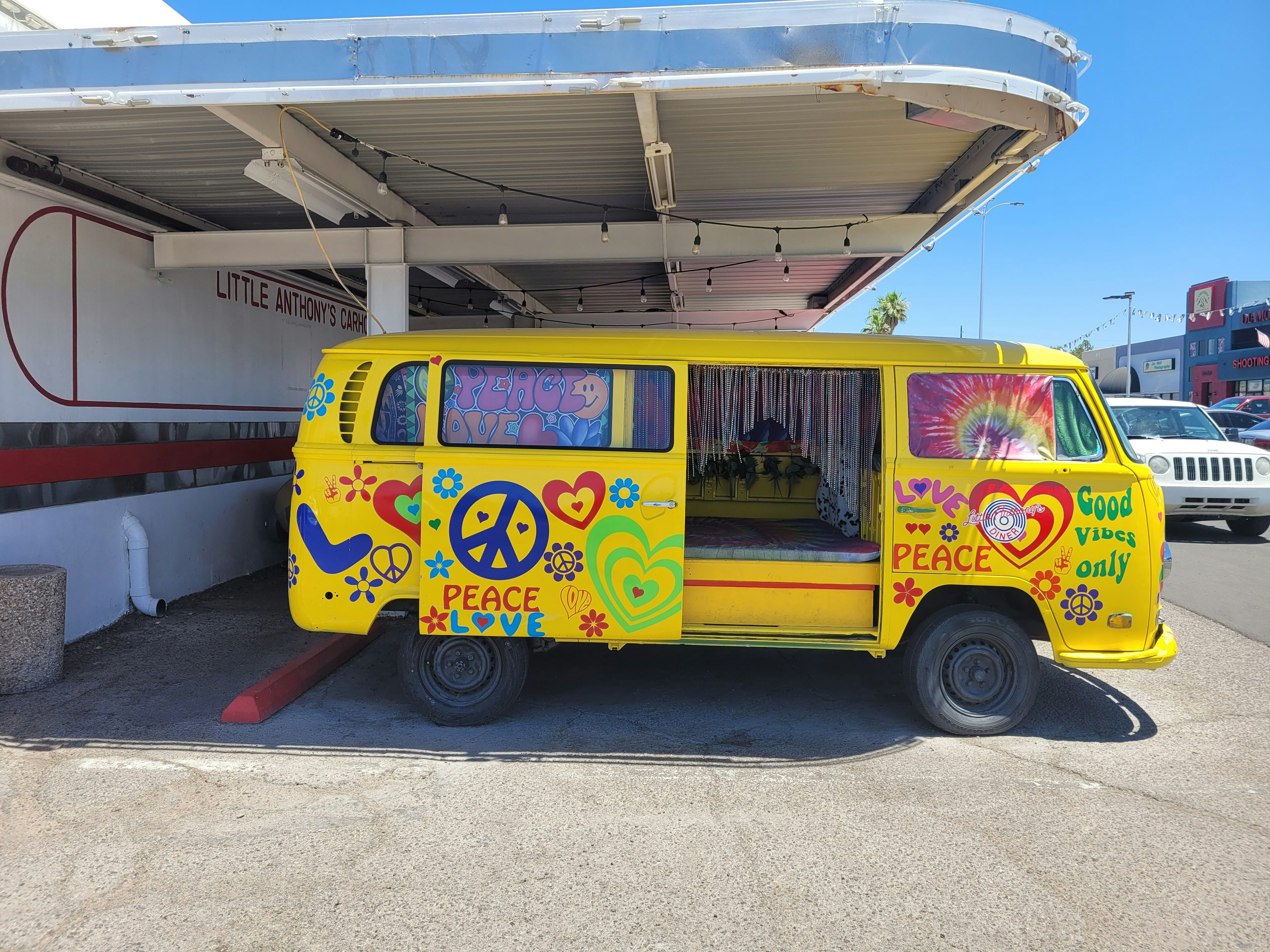 A yellow bus with a peace sign painted on it photo – Free Tucson Image ...