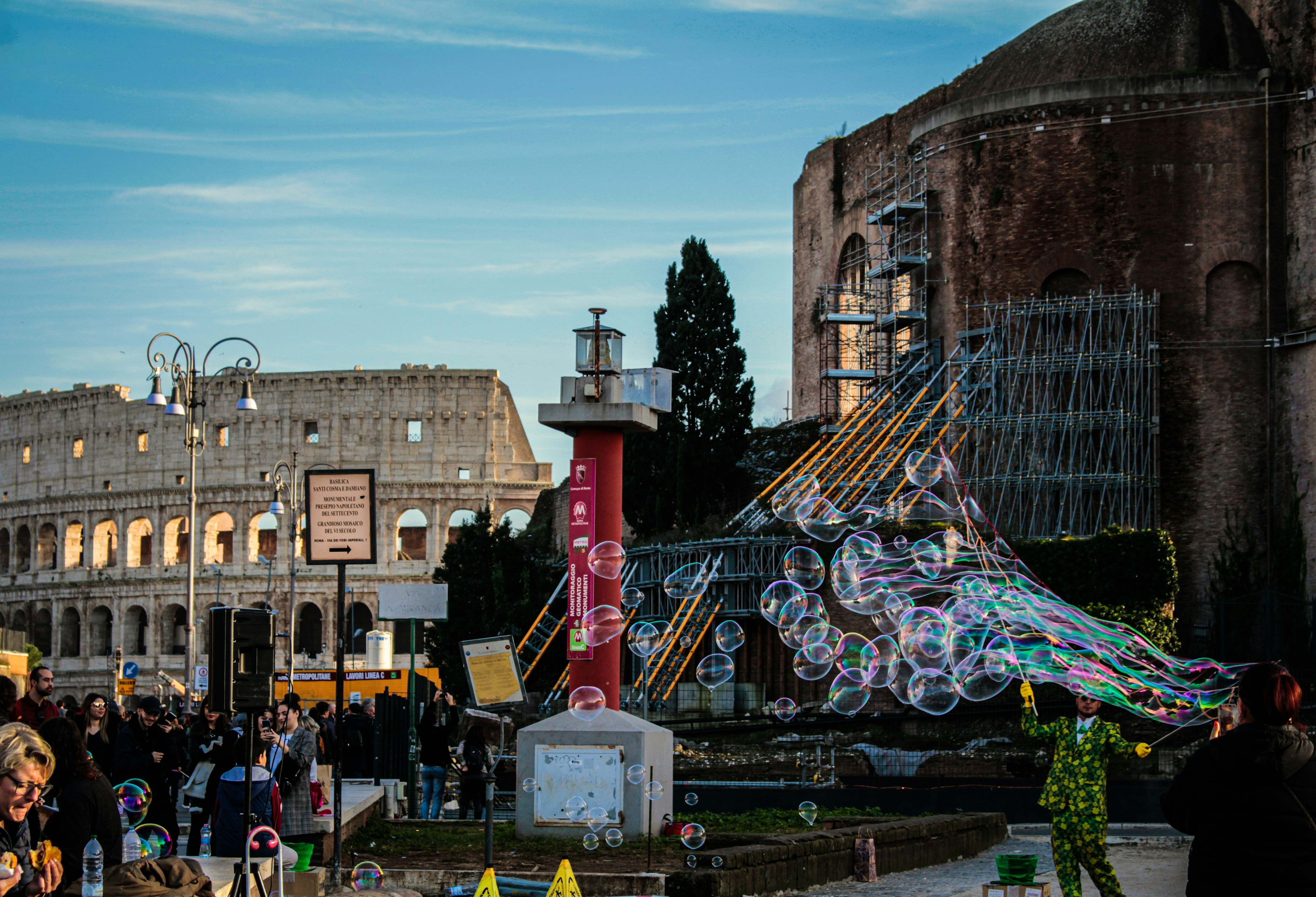 Playful Orbs and Old Walls: A Festive Moment in the Colosseum Square