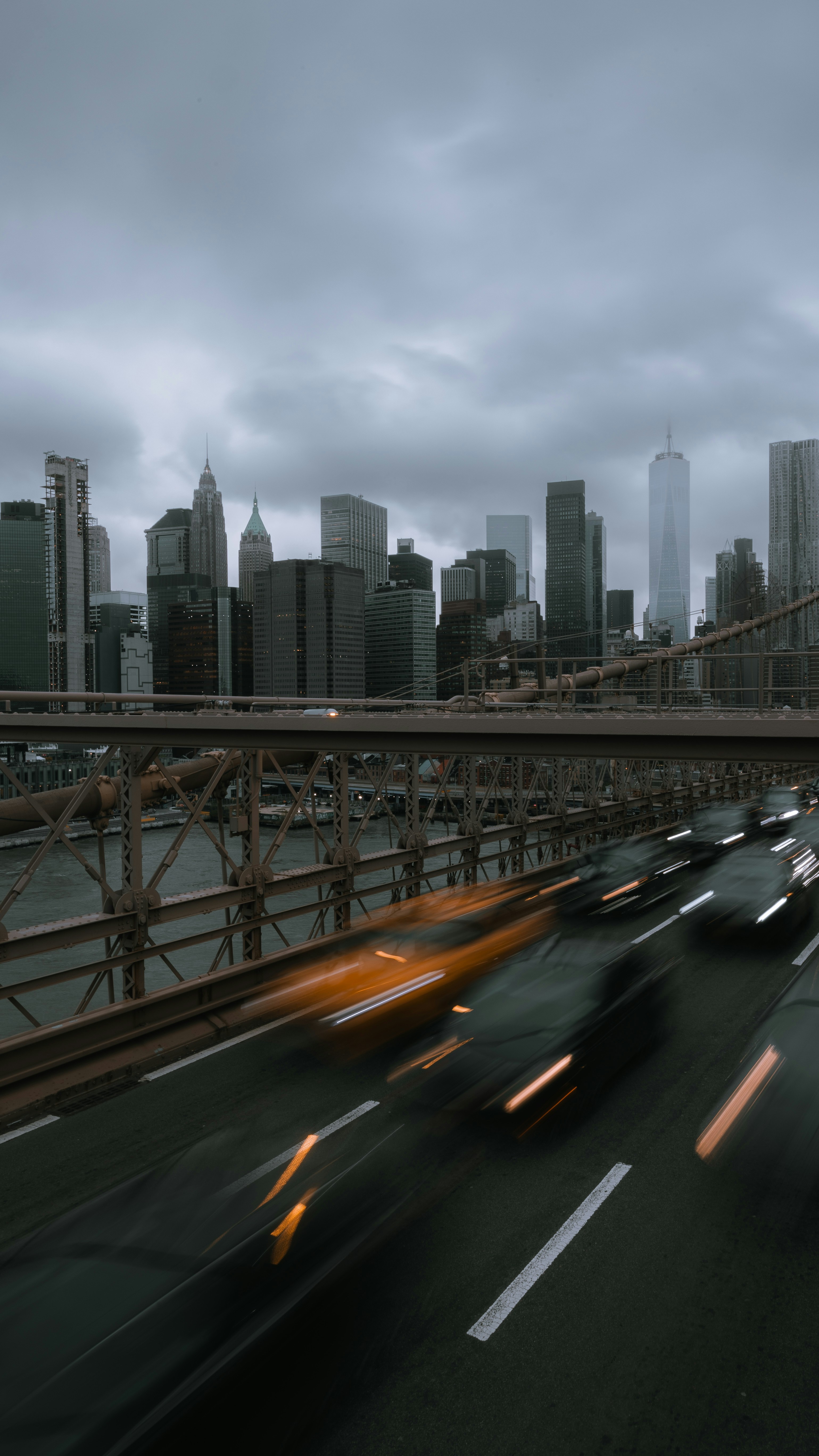 A view of a city skyline from a bridge photo – Free Brooklyn bridge ...