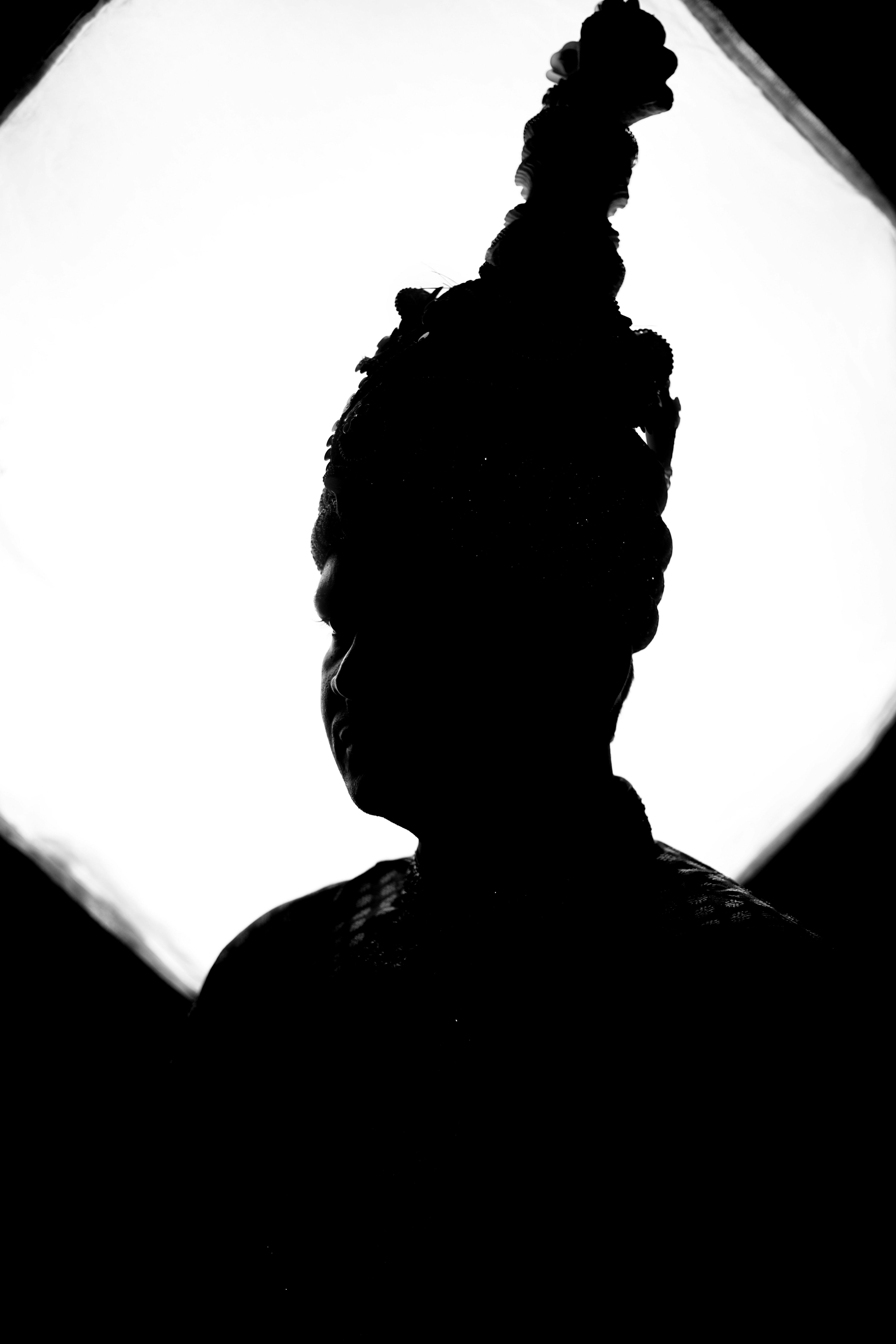 Diamond Backlight: Buddha Bust Silhouette Within a Geometric Halo