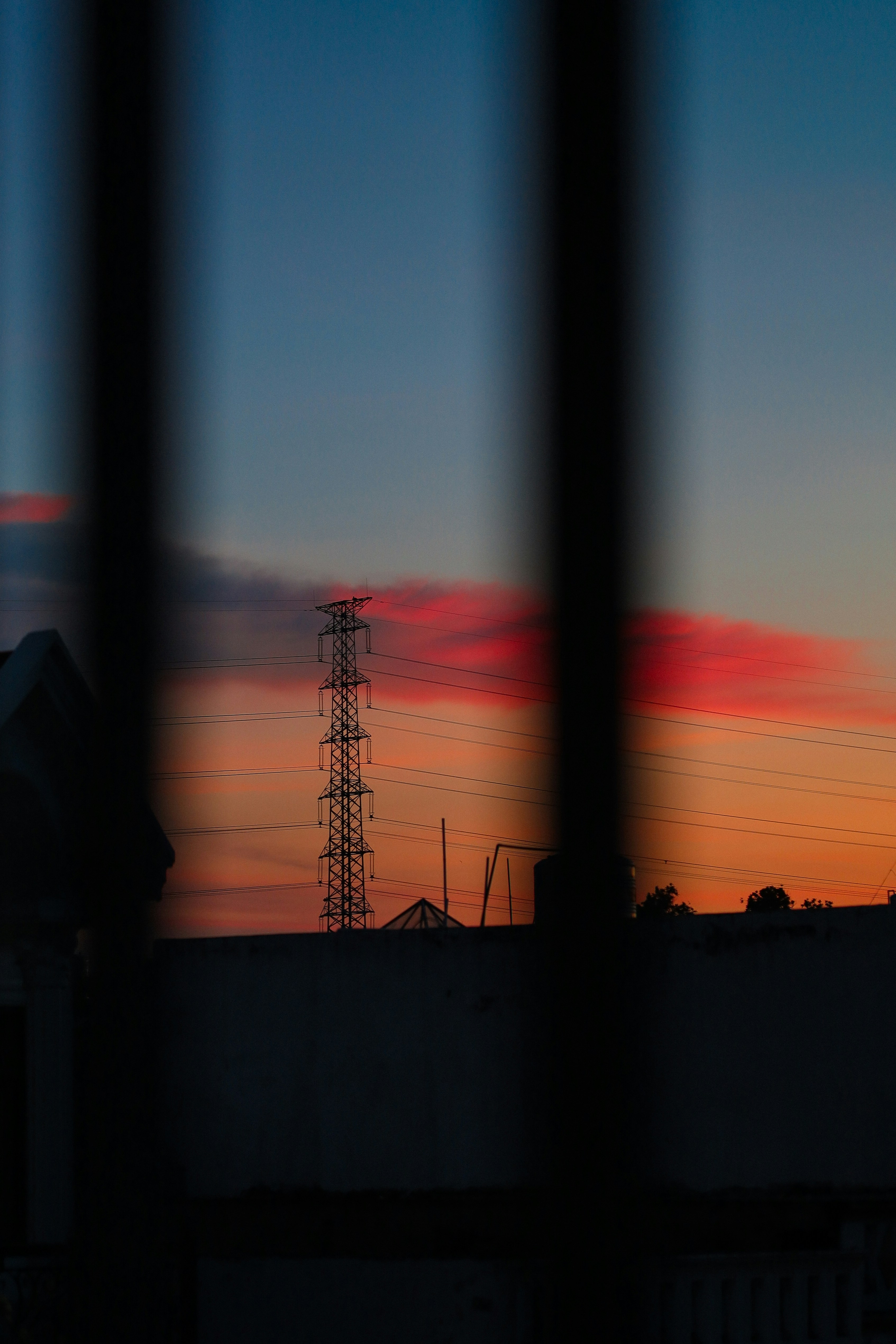 Sunset Skyline Framed by Vertical Shadows