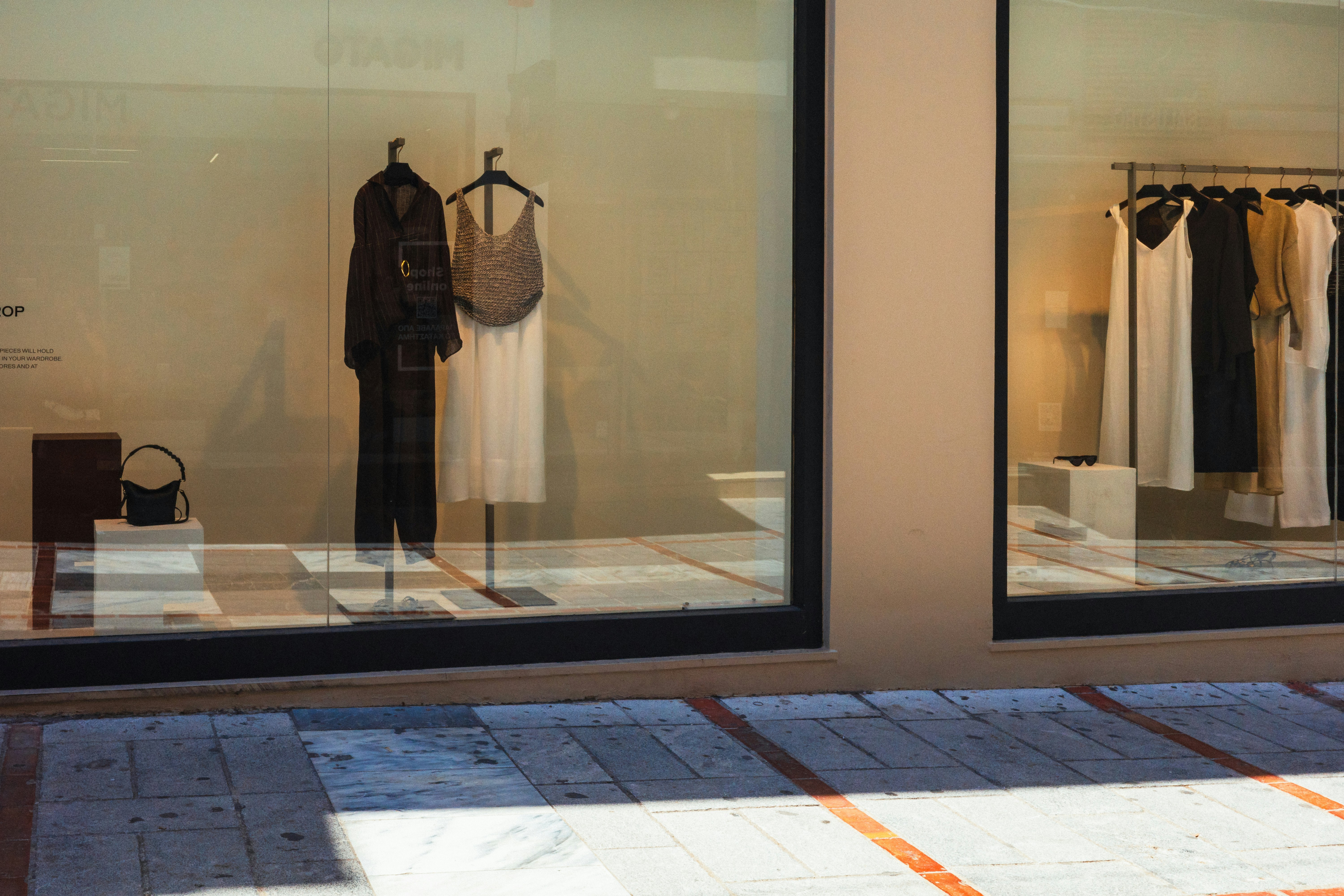 A store front window with clothes in it photo – Free Crete Image on ...