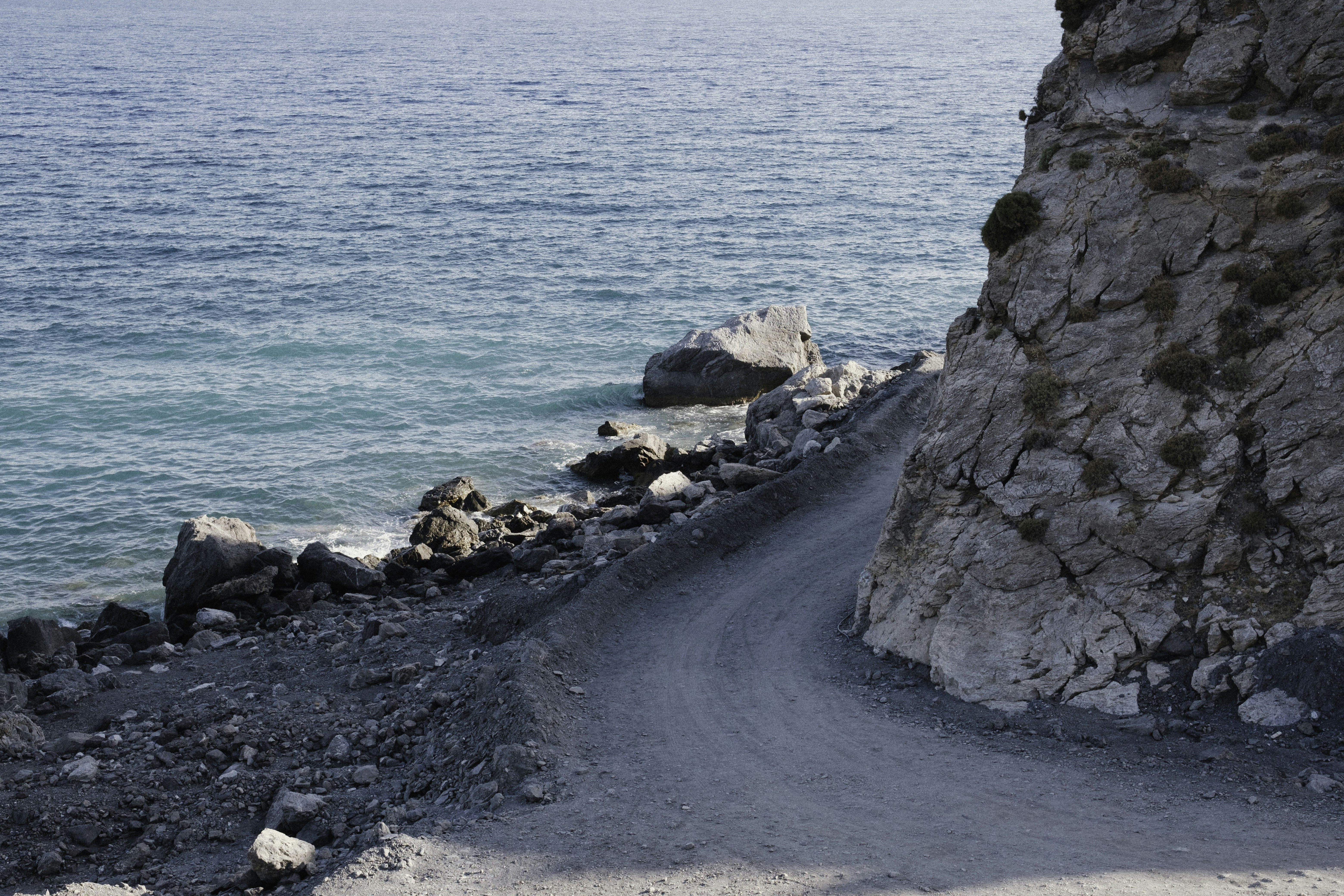 There is a large rock on the side of the road photo – Free Rock Image ...