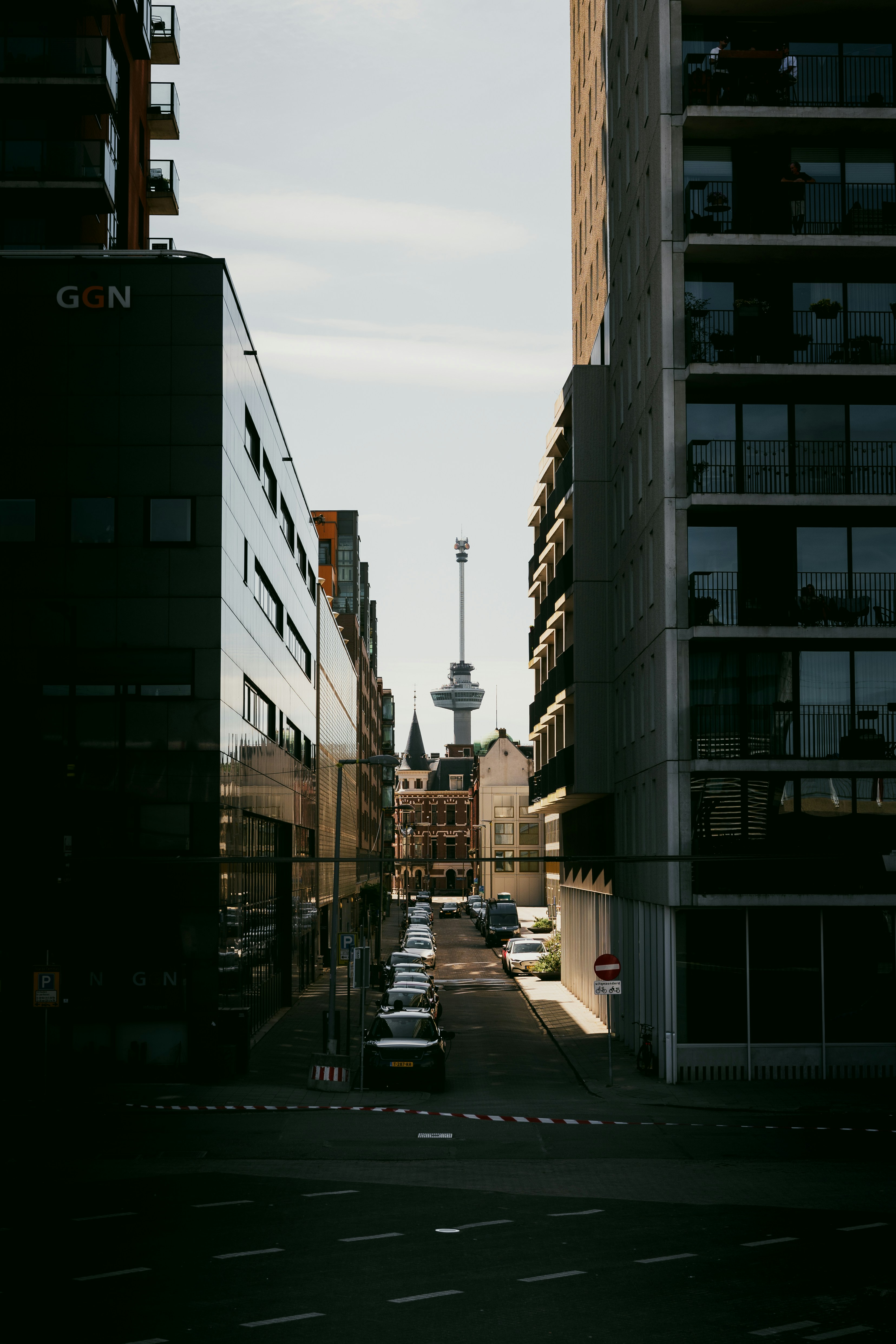 Between Giants: The Street's Quiet Lead Toward a Distant Spire