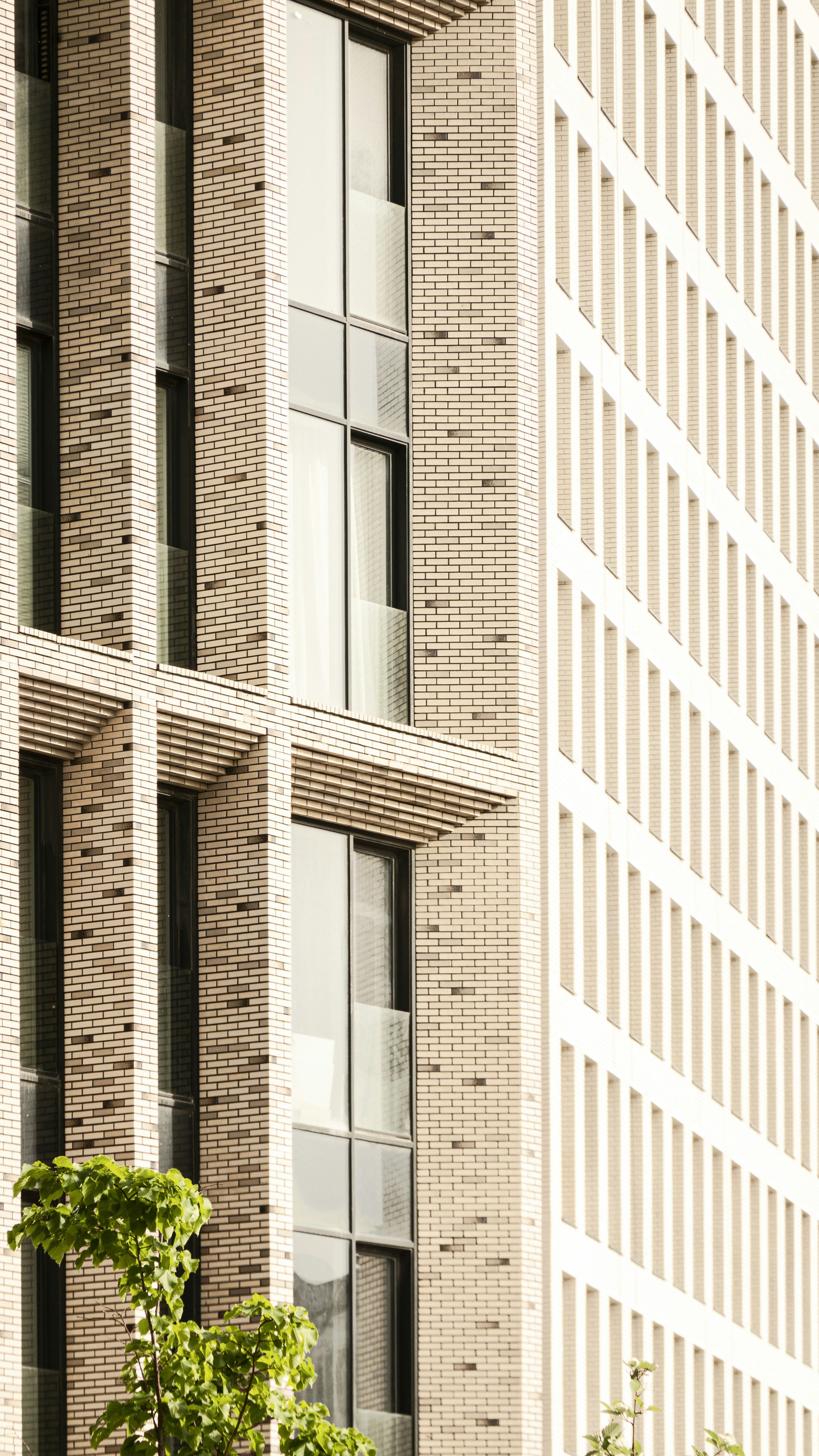 Sunlit Brick Towers: Vertical Rhythm Meets Diagonal Light