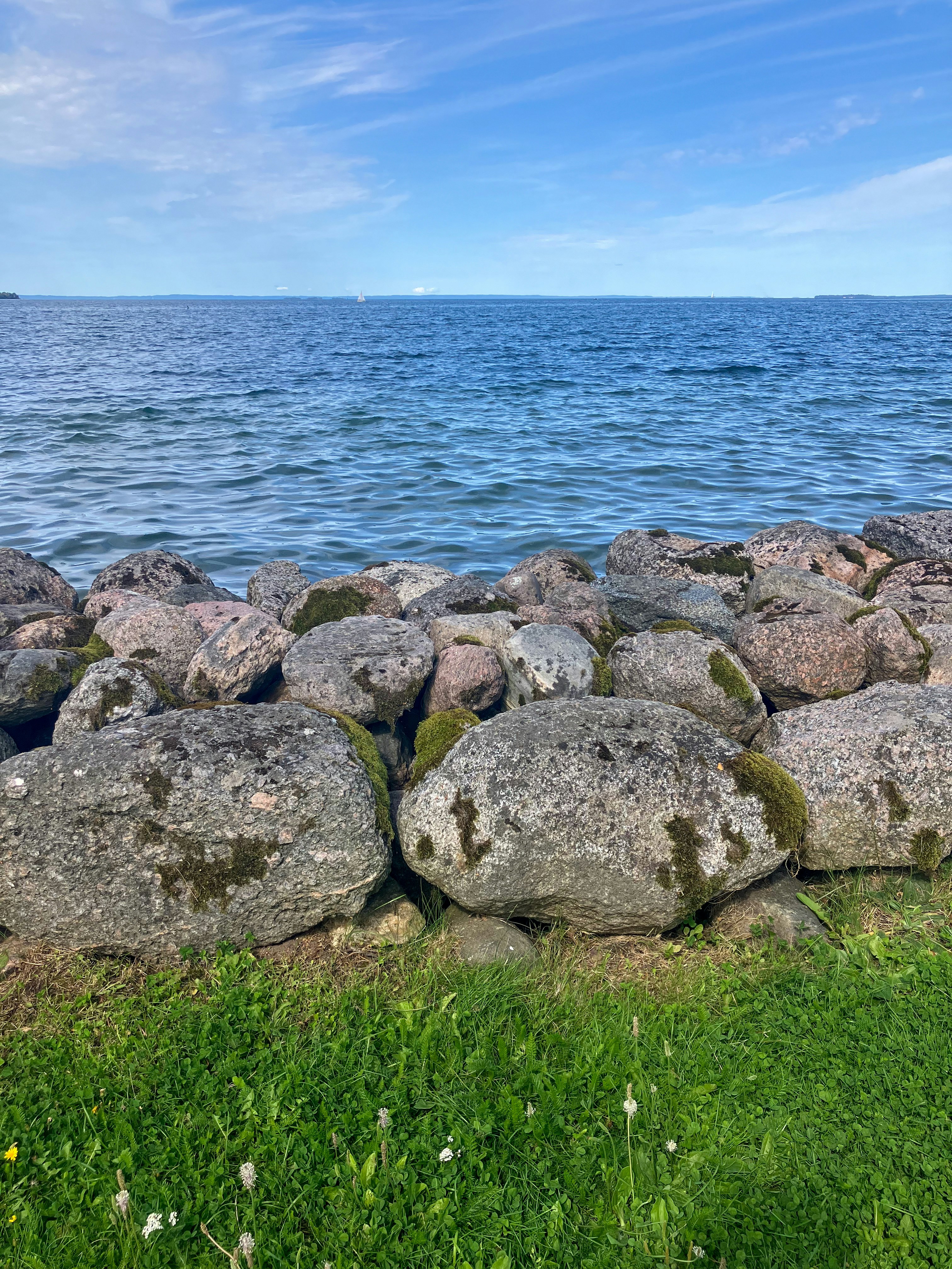 Tide-Worn Boulders Guard a Quiet Blue Sea