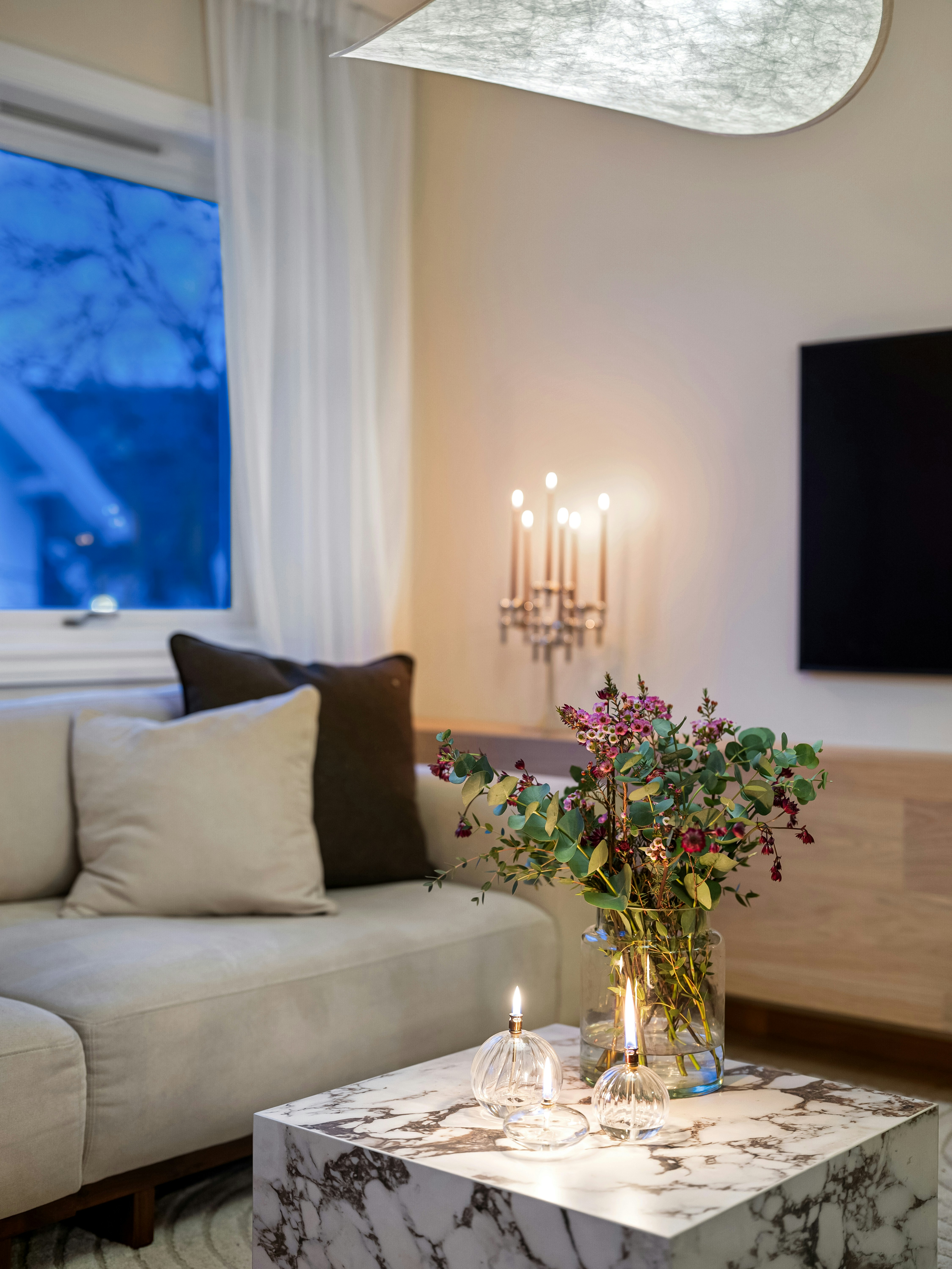 Marble Table Bloom: Candlelight in a Quiet Living Room