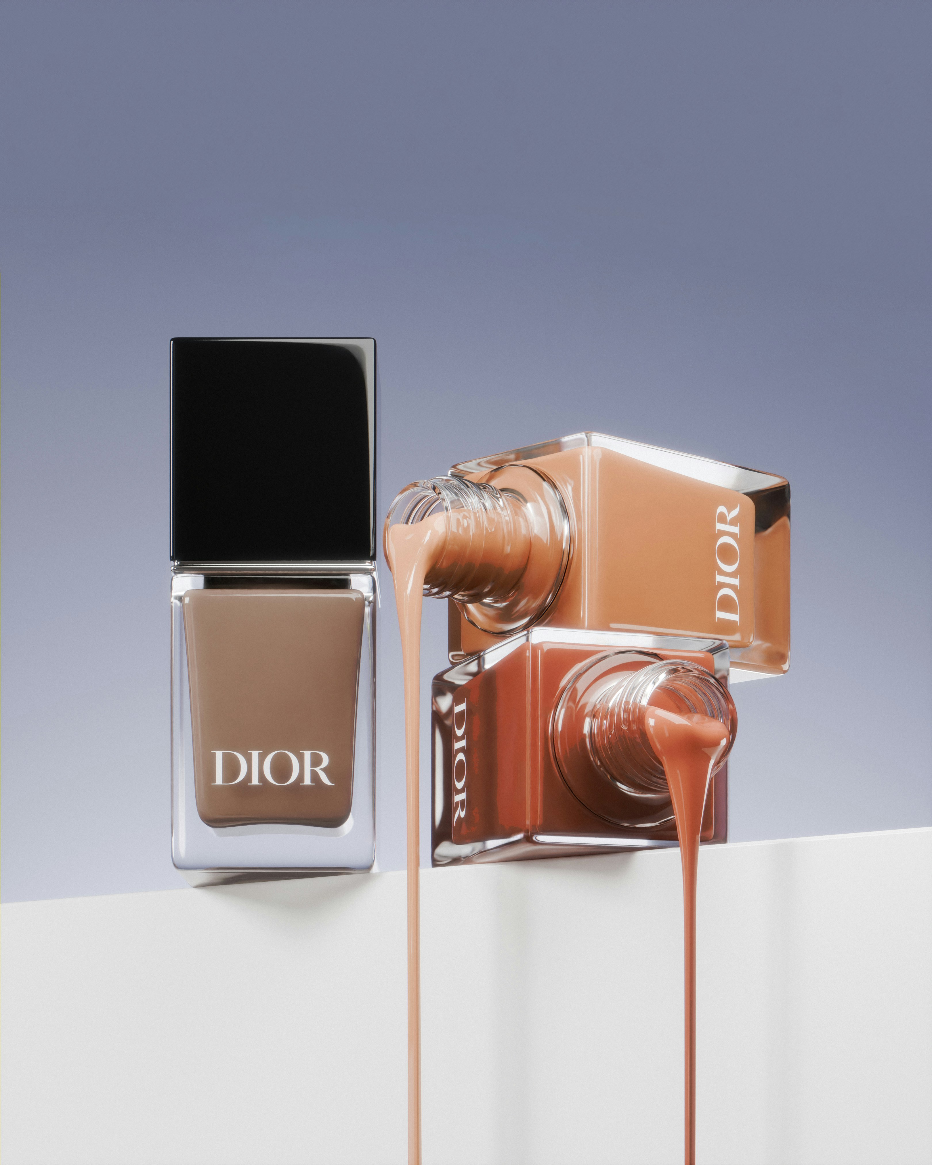 A bottle of dior's nail polish next to a bottle of dior photo – Free ...