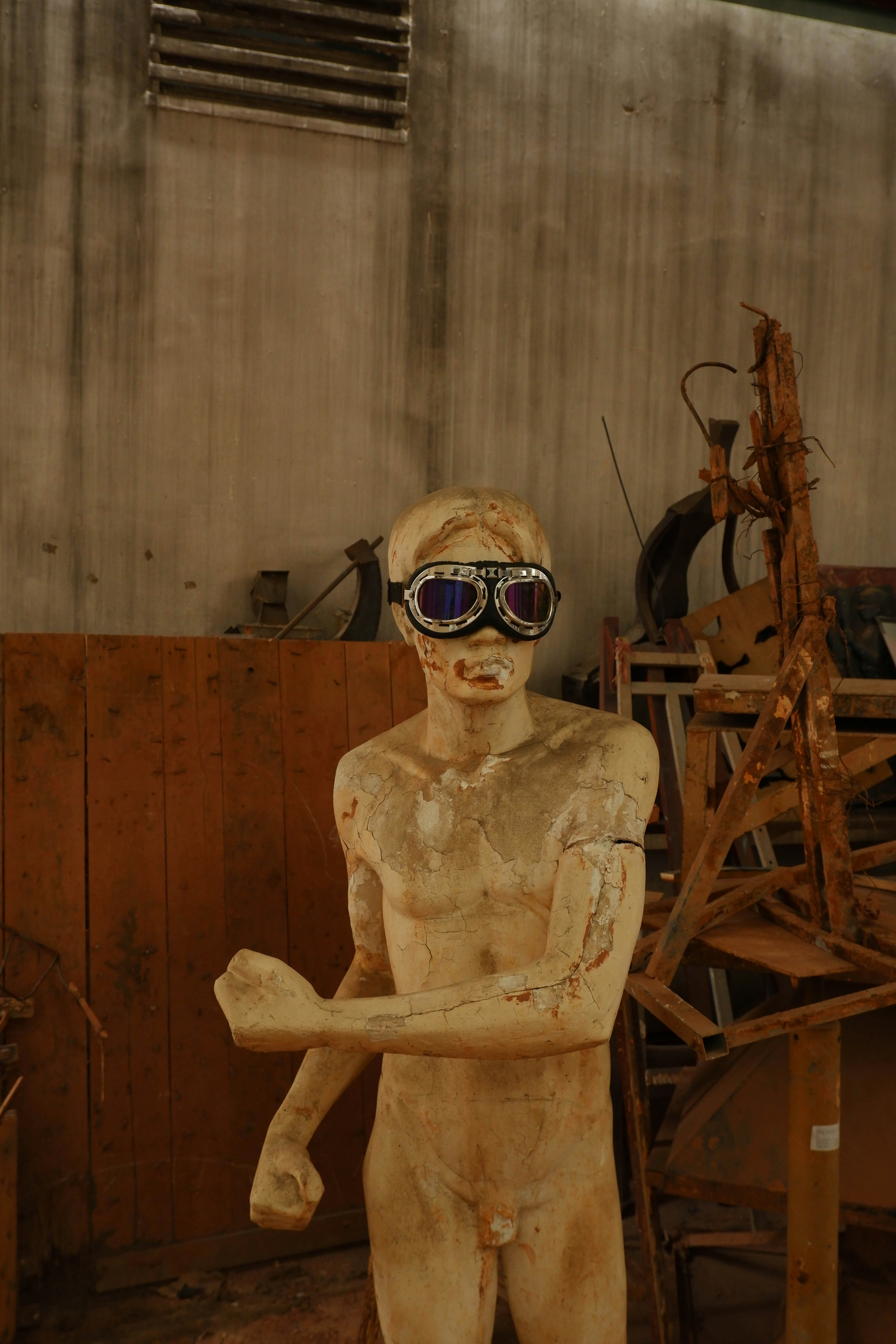 Goggled Sentinel in a Dusty Rust Workshop