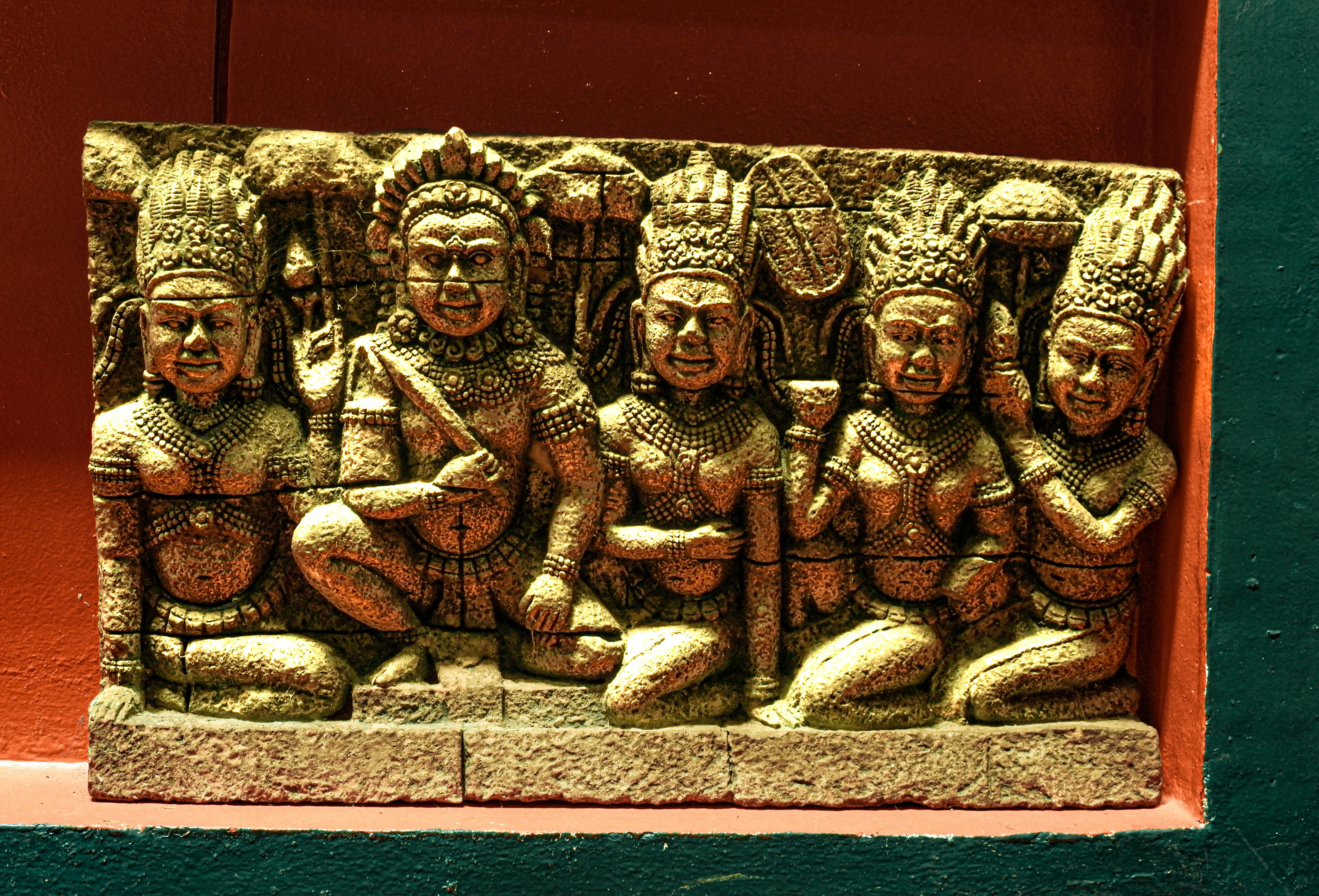 Relief Assembly: Five Regal Figures in a Red-Framed Stone Panel