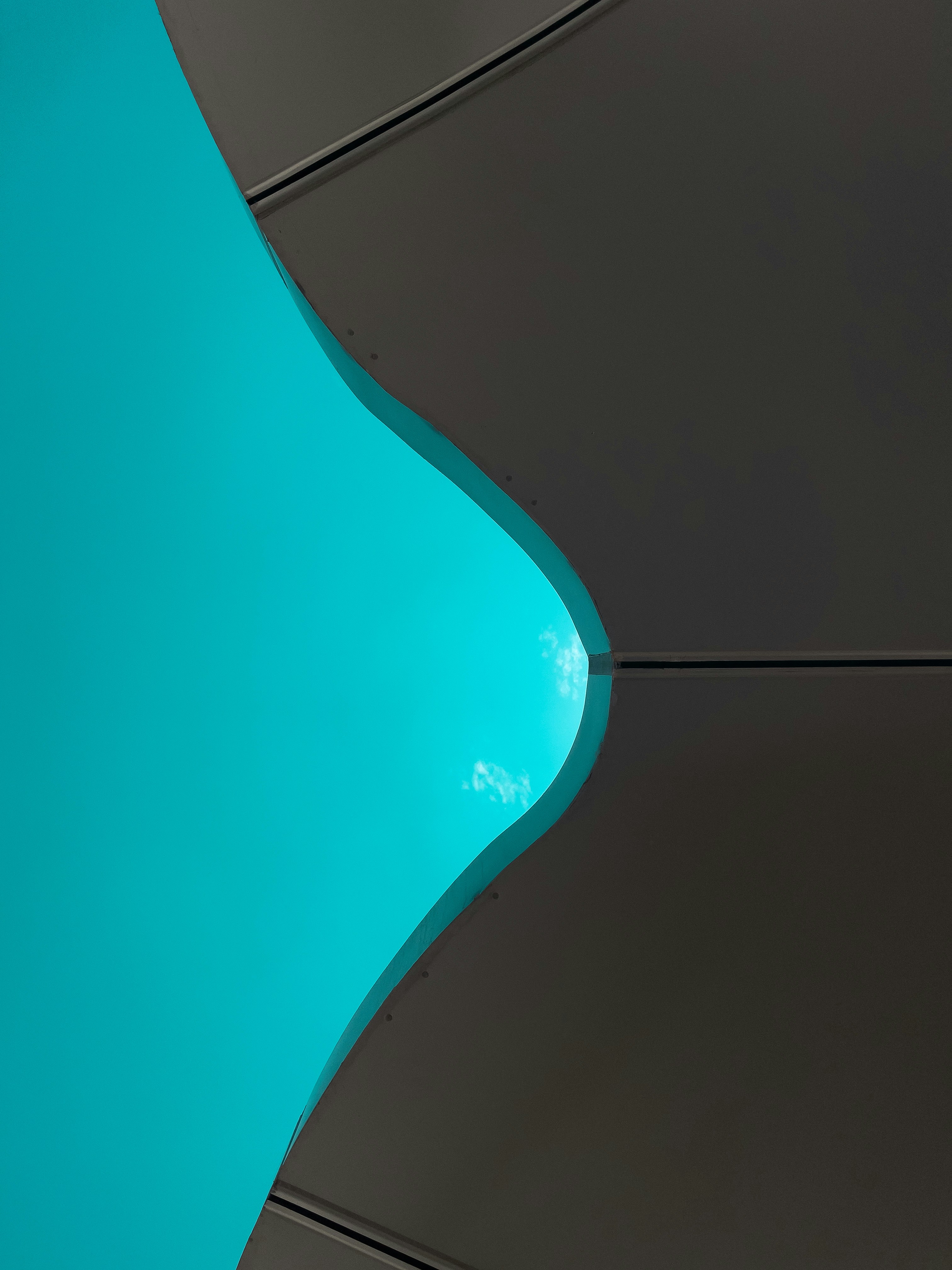 Teal Curve Against Charcoal Planes: A Minimal Geometry Portrait