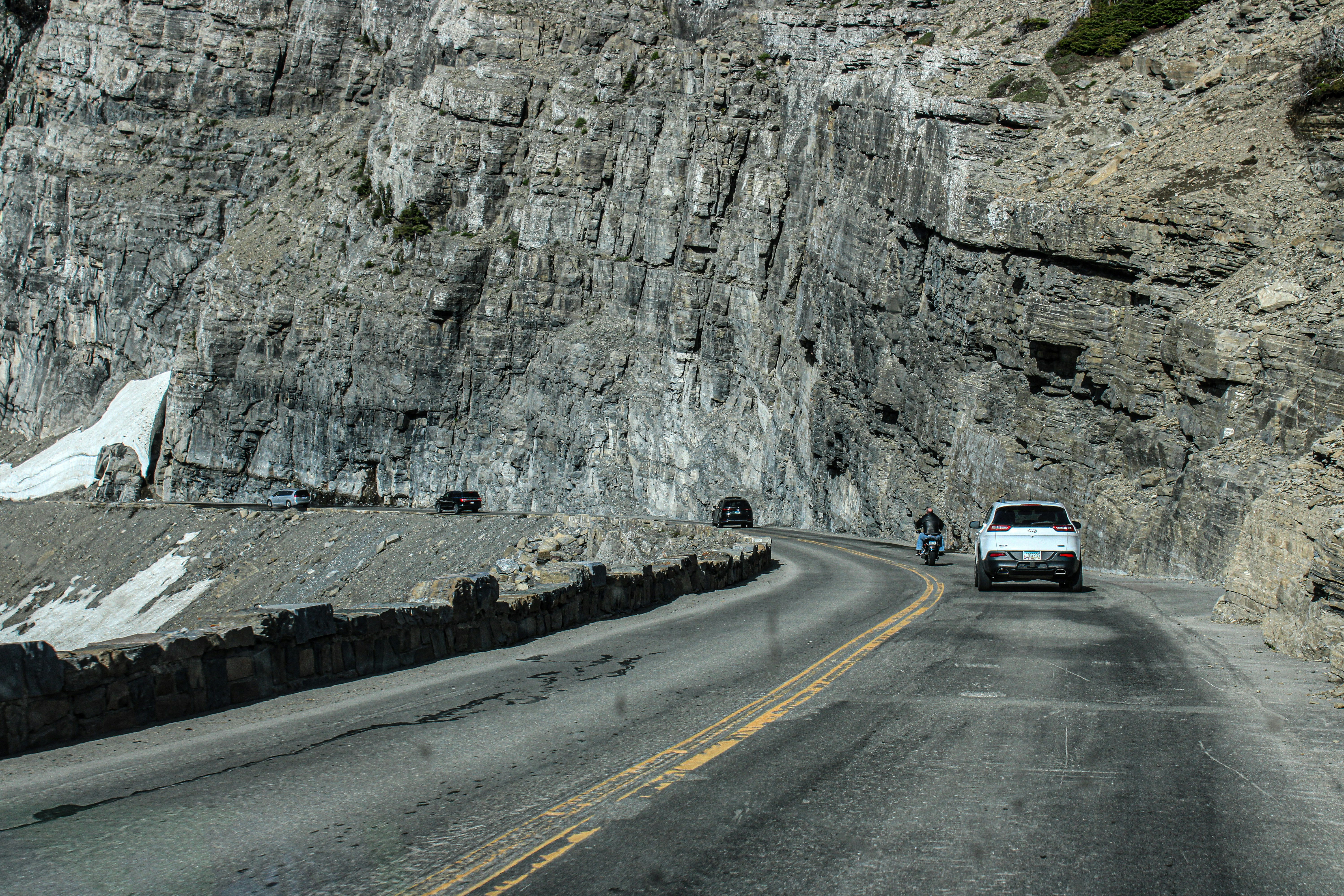Cliffside Corridor: Mountain Road Between Stone and Sky