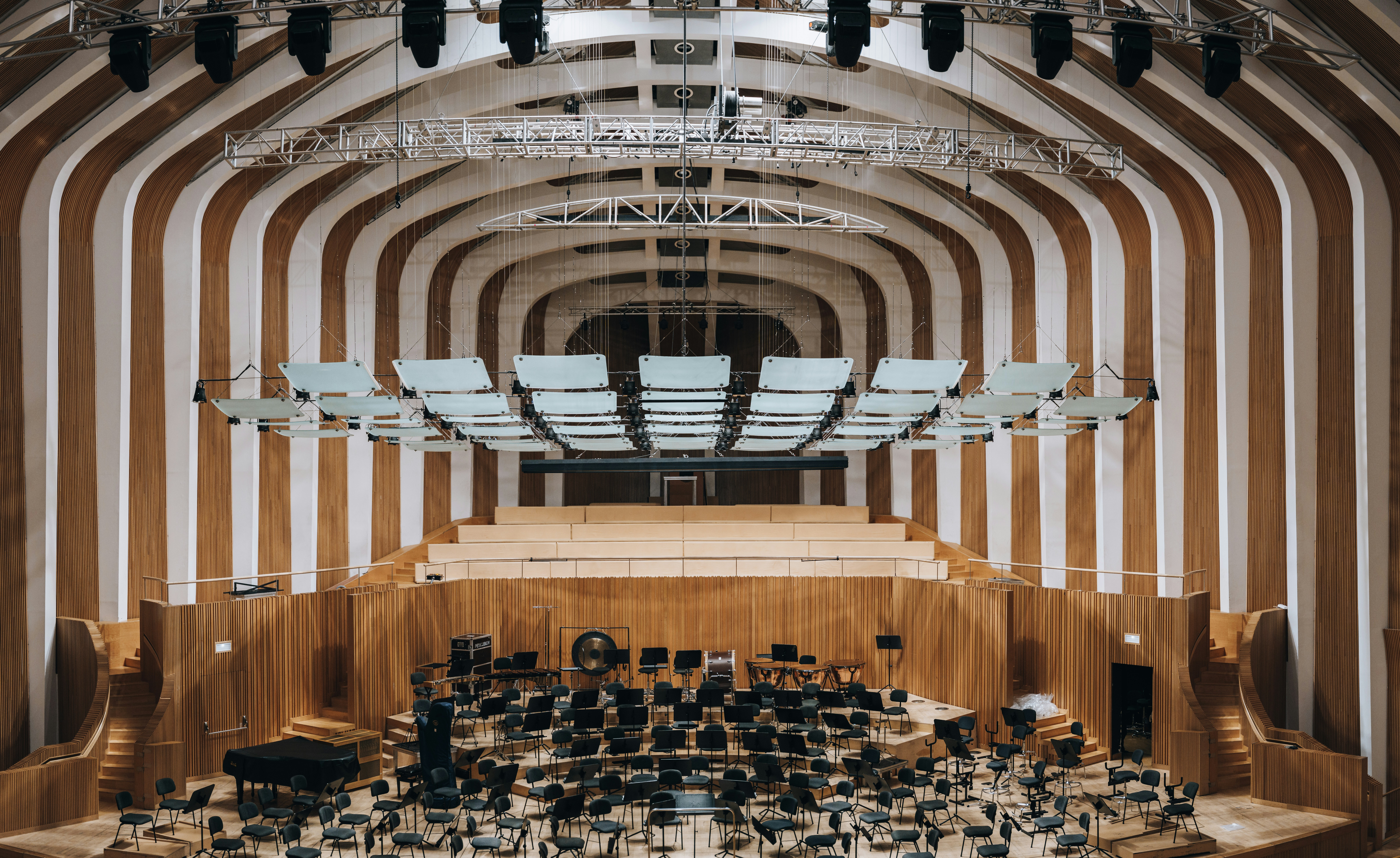 A large concert hall with lots of seats photo – Free Human Image on ...
