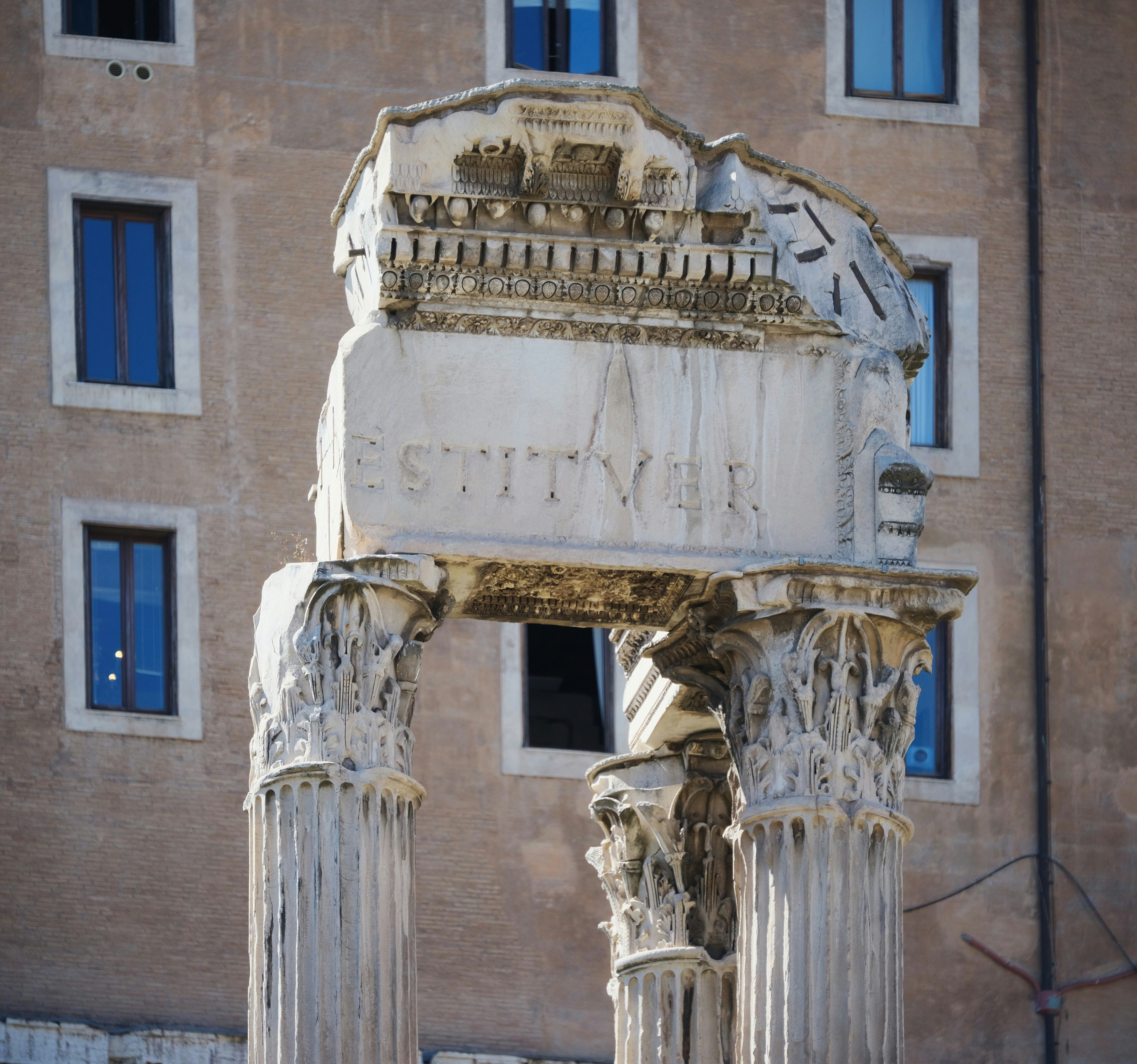 Corinthian Fragments Framing a Modern Facade