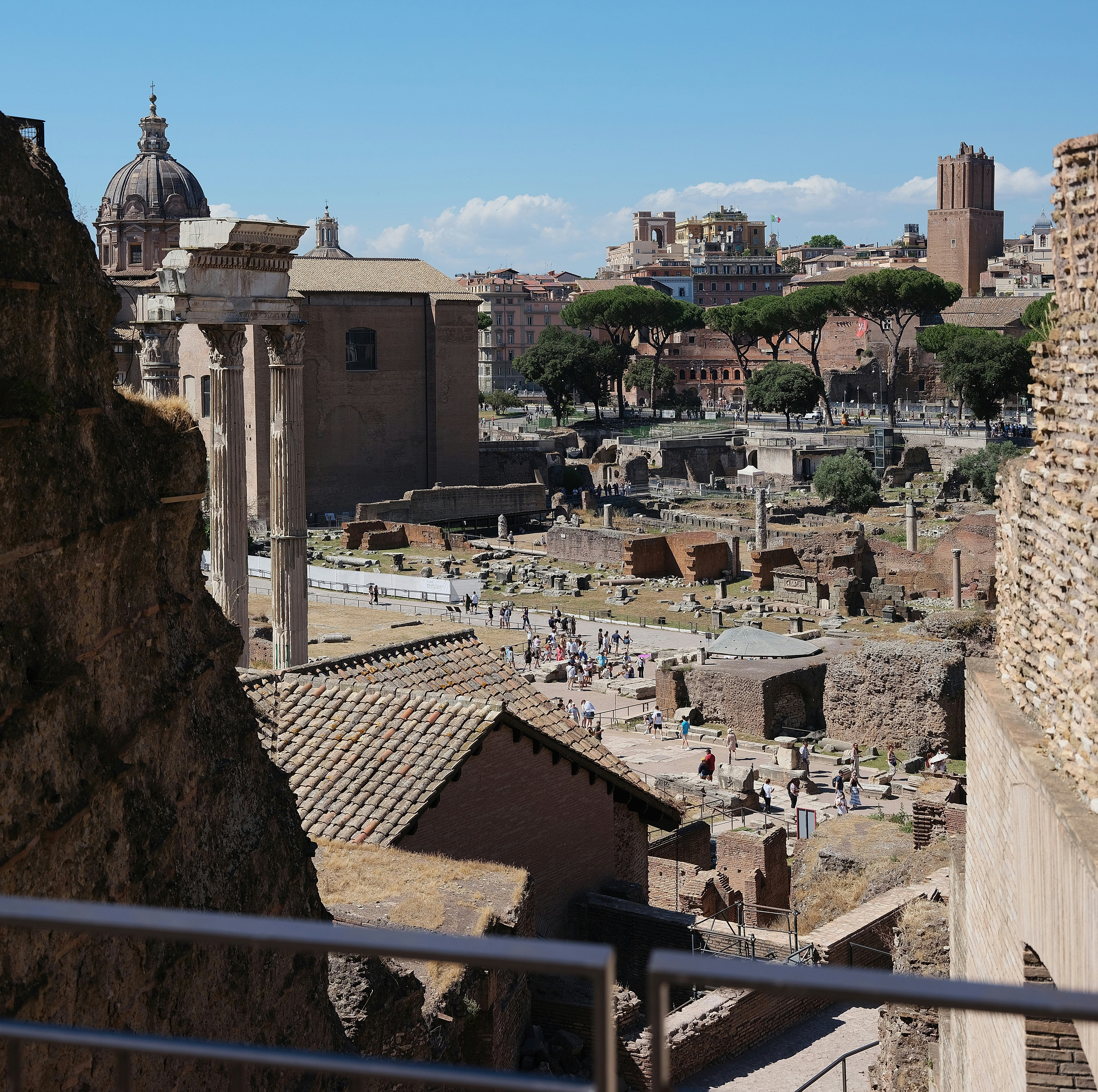Echoes Across Stone: Sunlit Ruins and City Skyline