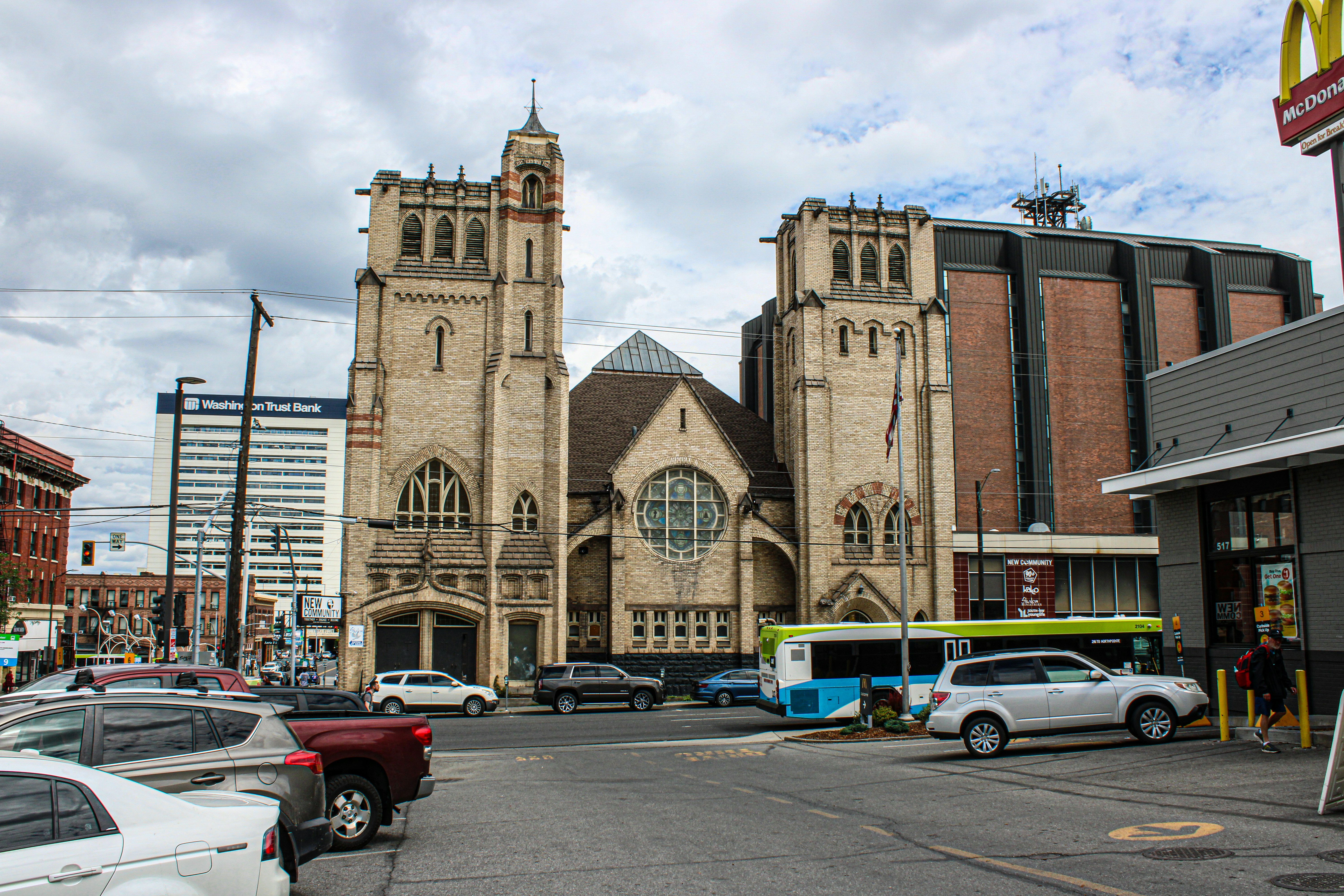 Twin-Towered Cathedral at the Heart of a Bustling City Street