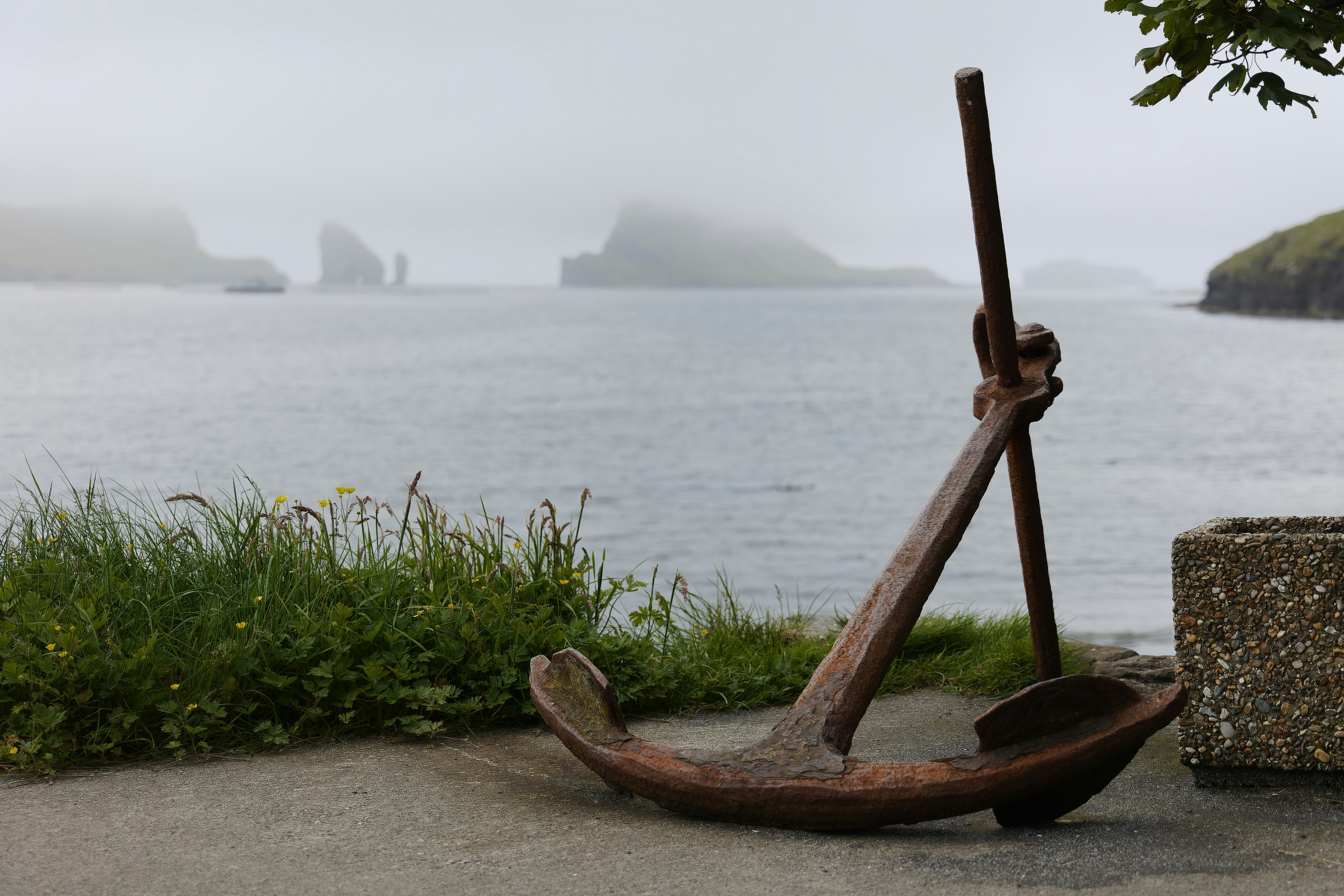 An anchor on the shore of a body of water photo – Free Sea Image on ...