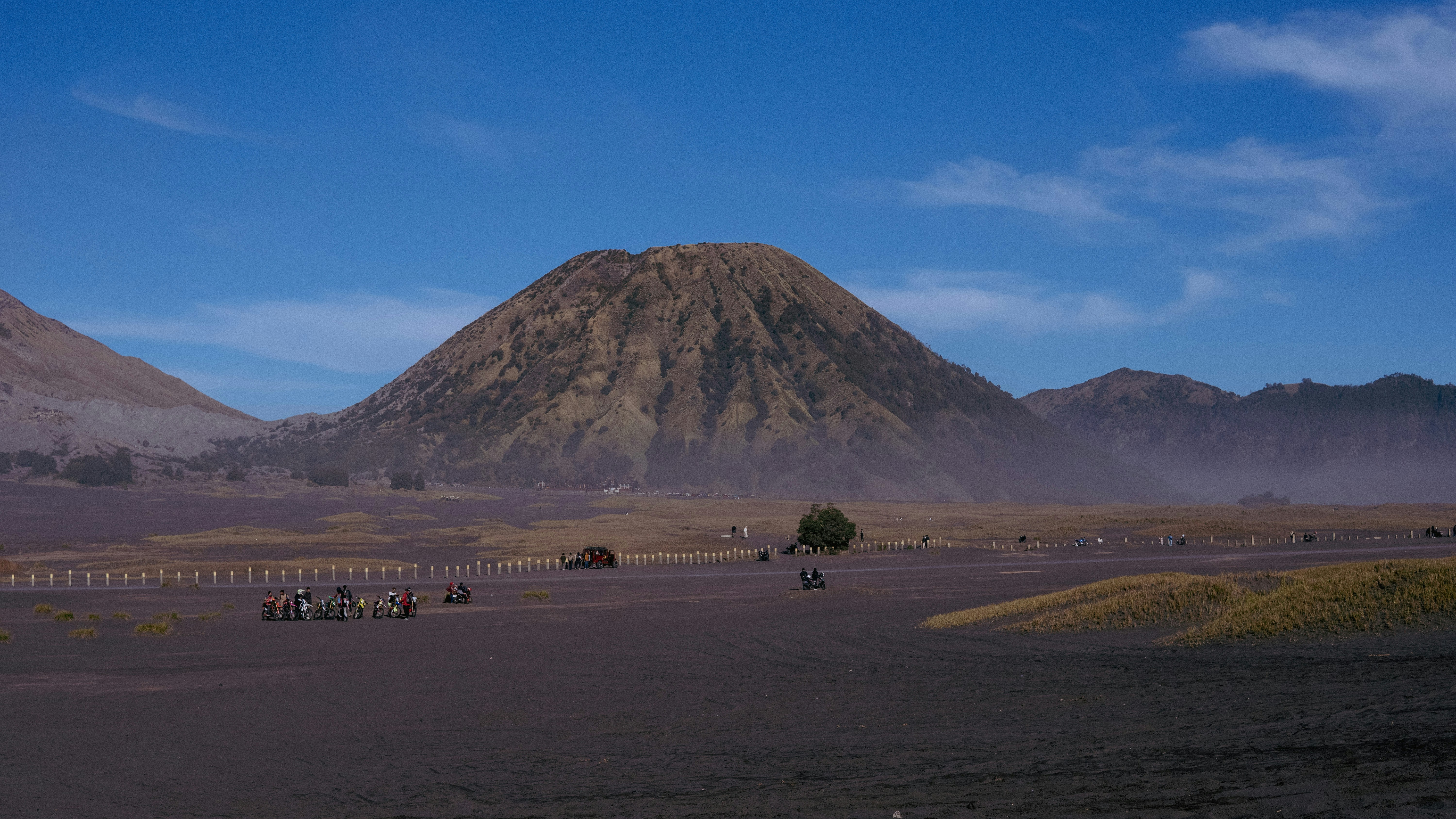 The Central Cone Looms Over a Sparse Desert Plain