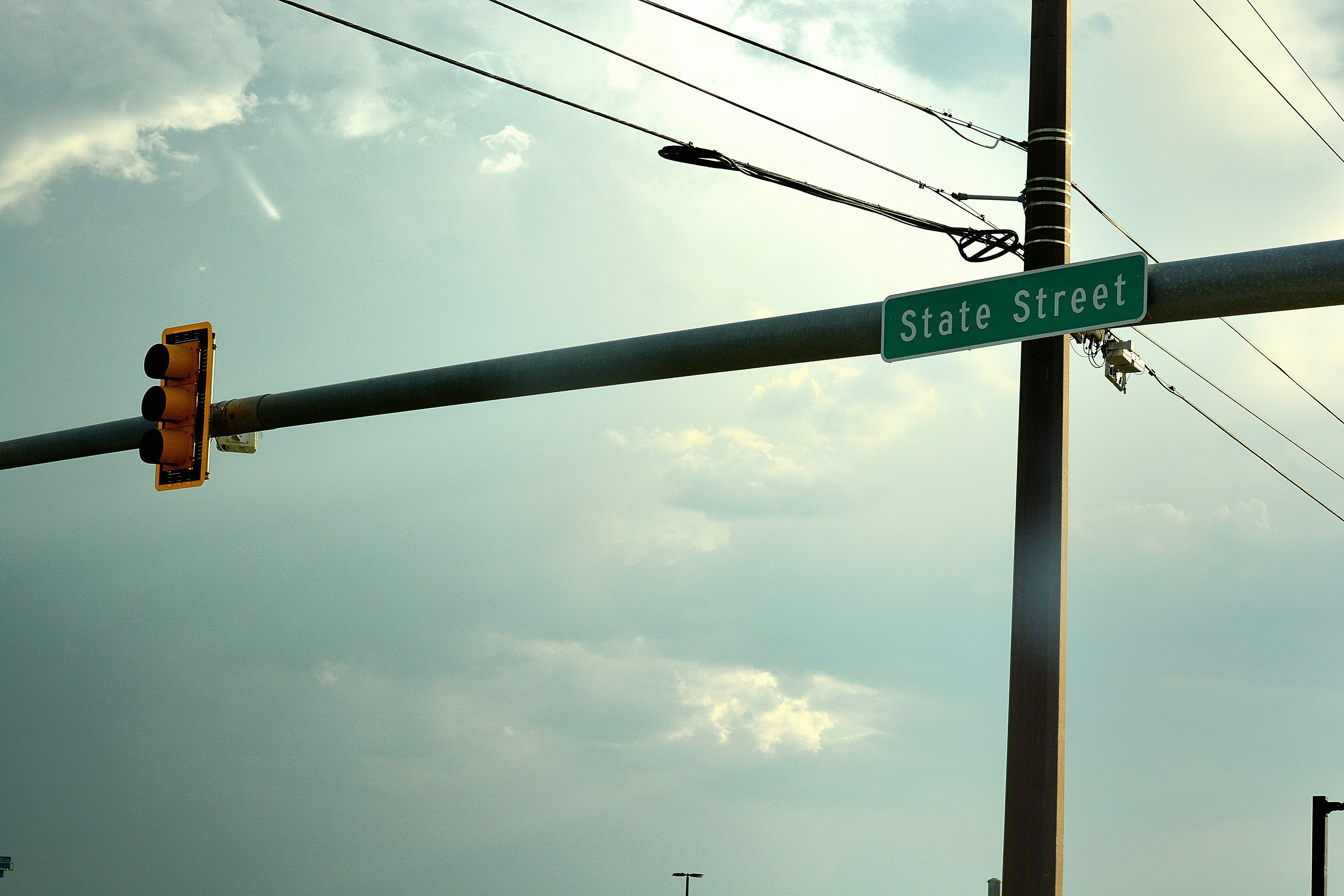 A traffic light sitting on the side of a road photo – Free Light Image ...