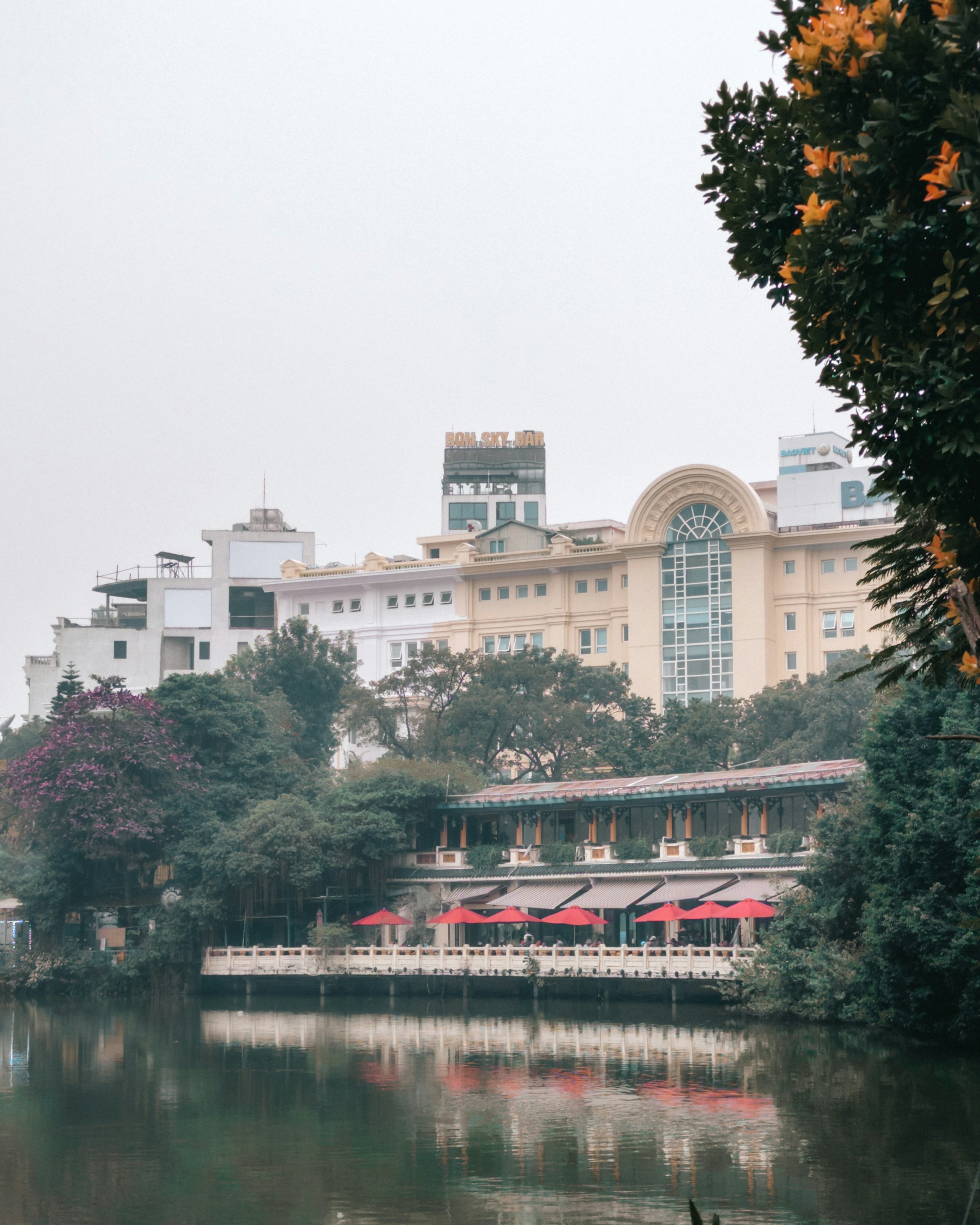 Echoes by the Lake: Urban Arcadia Framed by Trees and Water