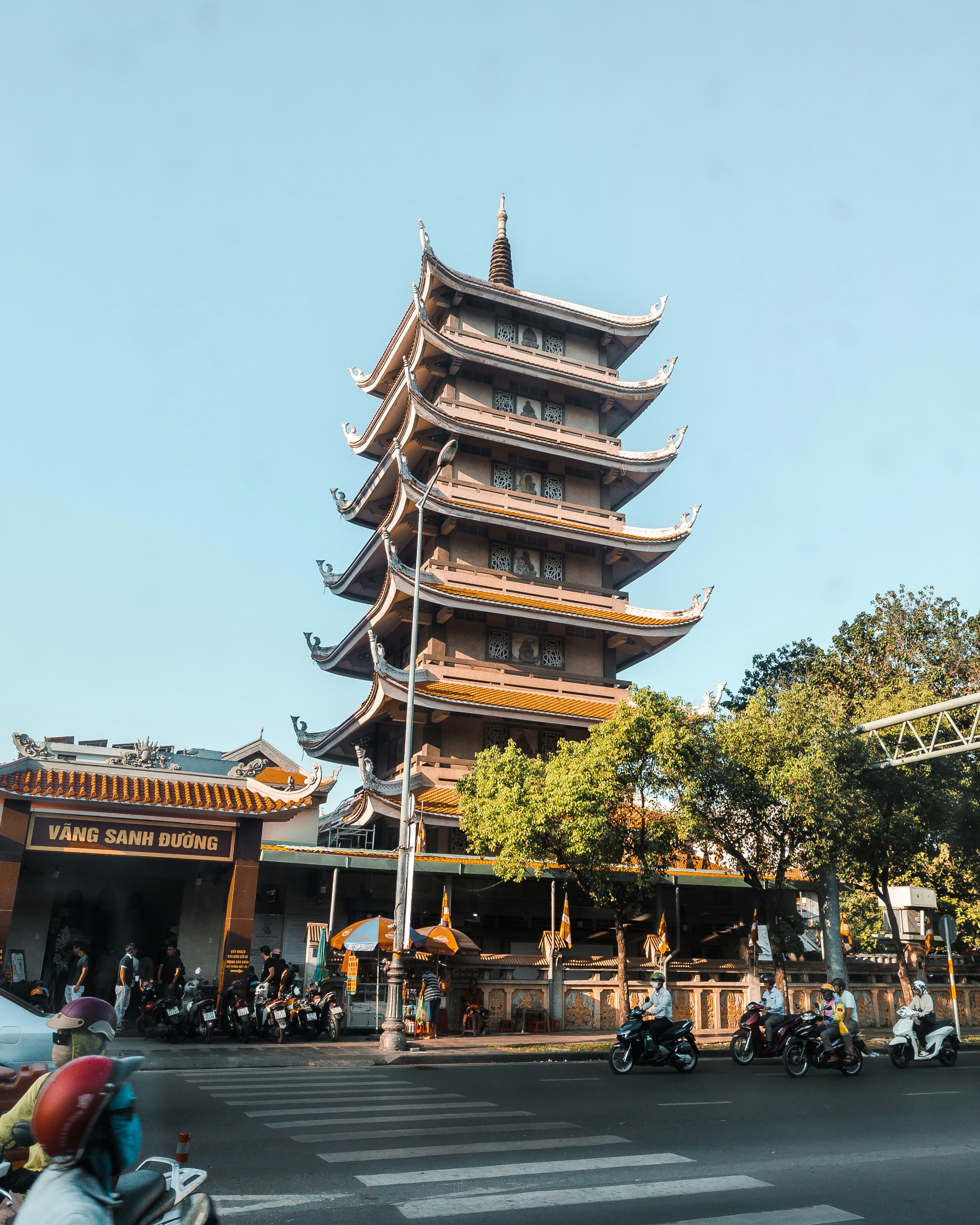 Ten-Tiered Guardian: The City Gatehouse Behind the Motorbikes