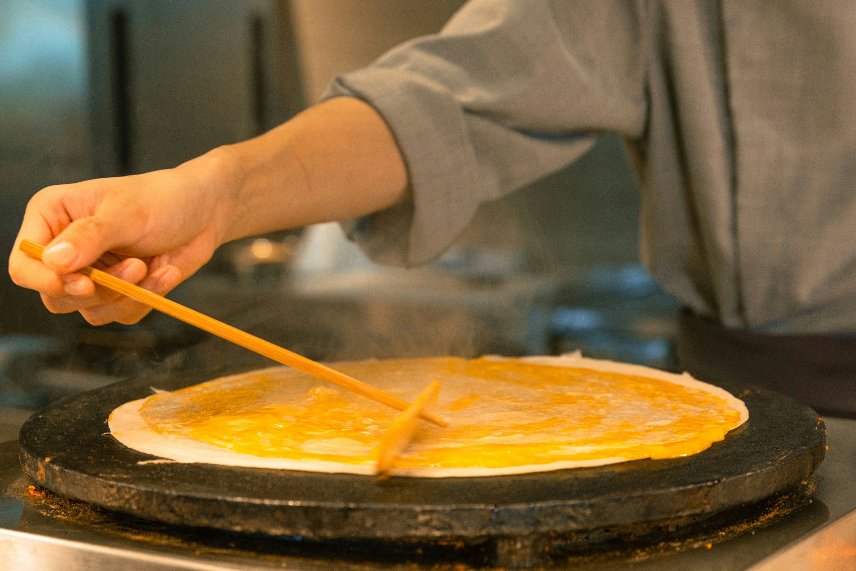A person cooking pancakes in a pan on a stove photo – Free Pancake ...