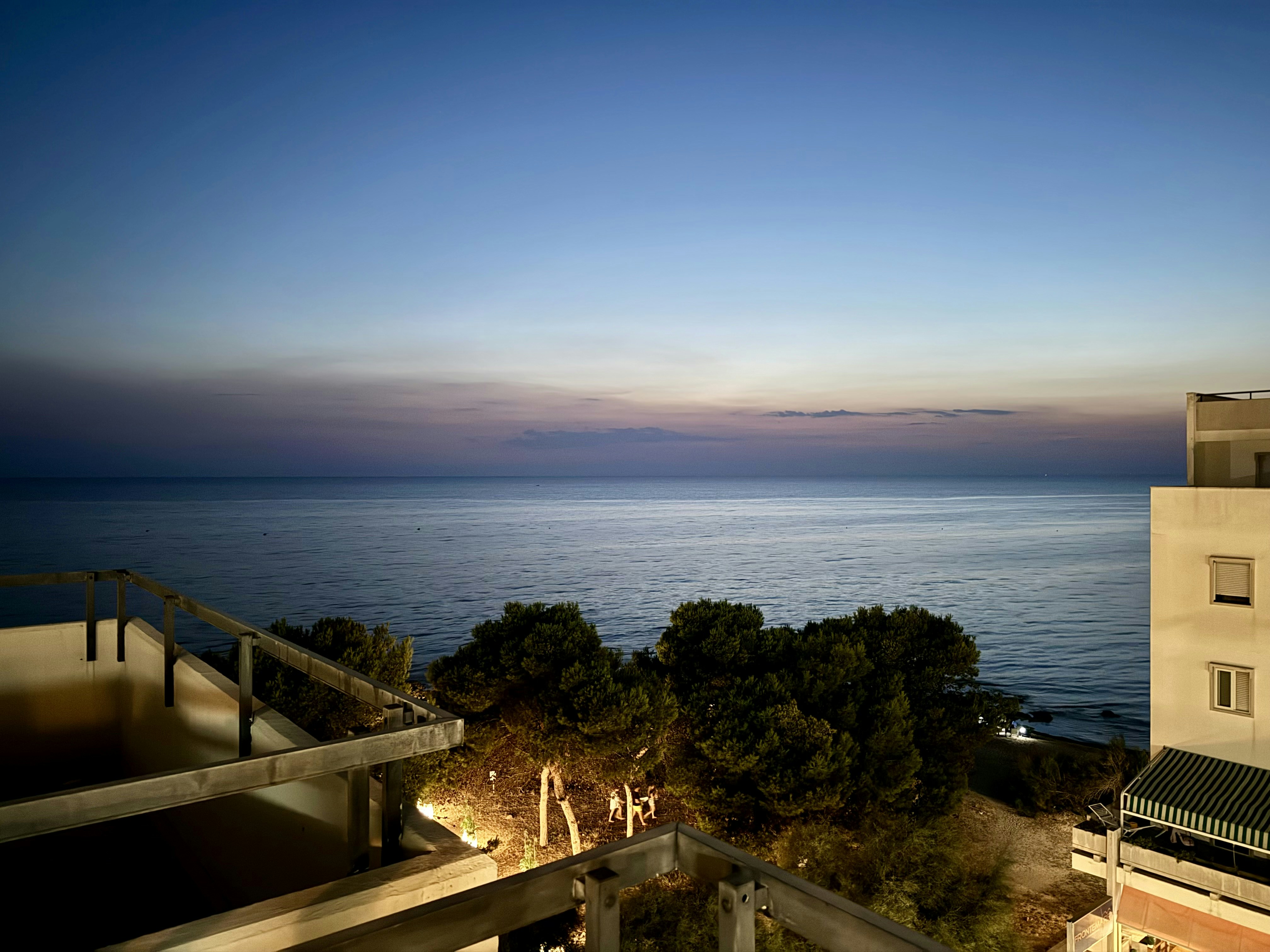 A view of the ocean from a high rise building photo – Free Province of ...