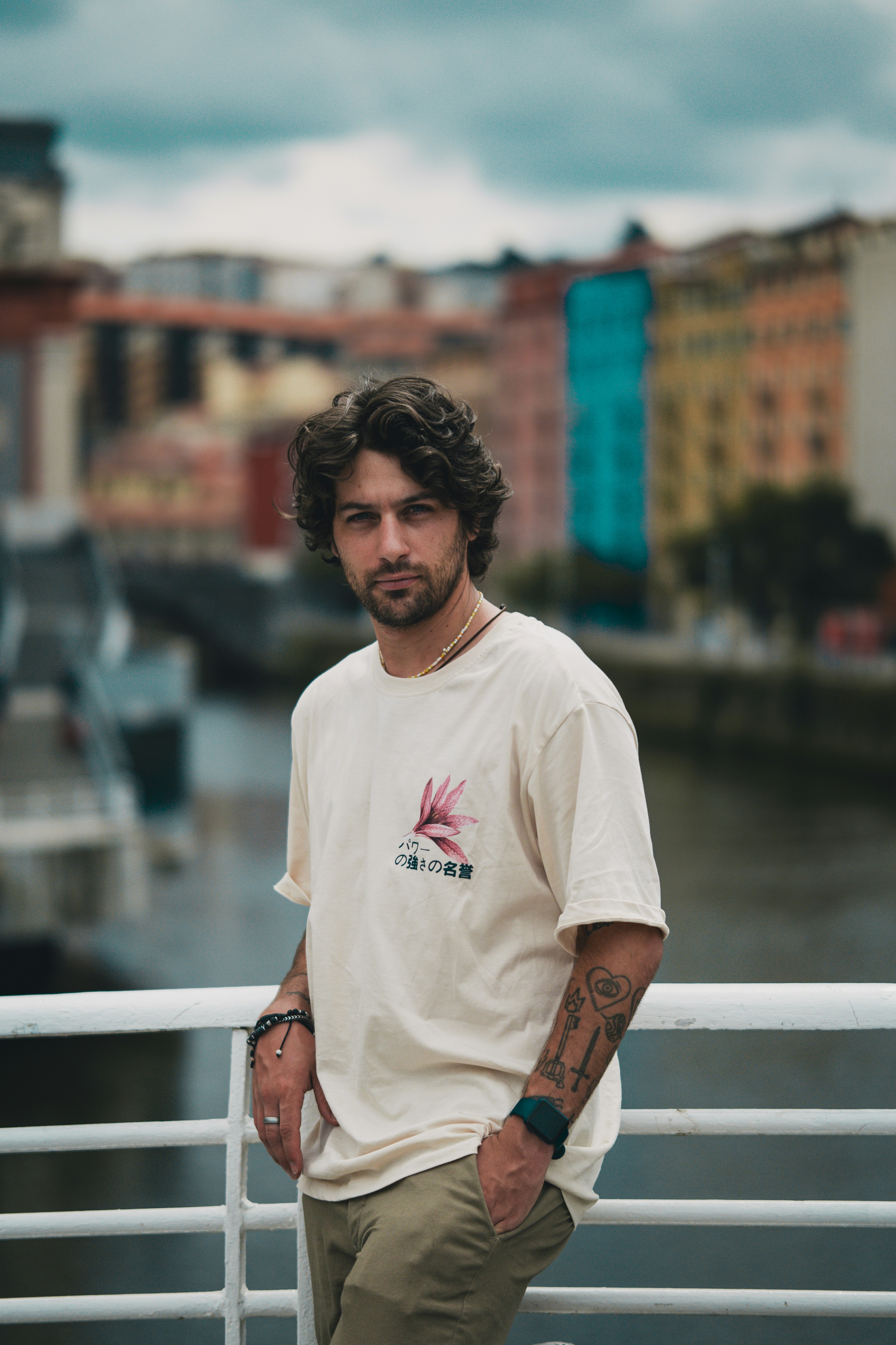 Harbor Portrait: Quiet Confidence Framed by a Kaleidoscope of Riverfront Buildings