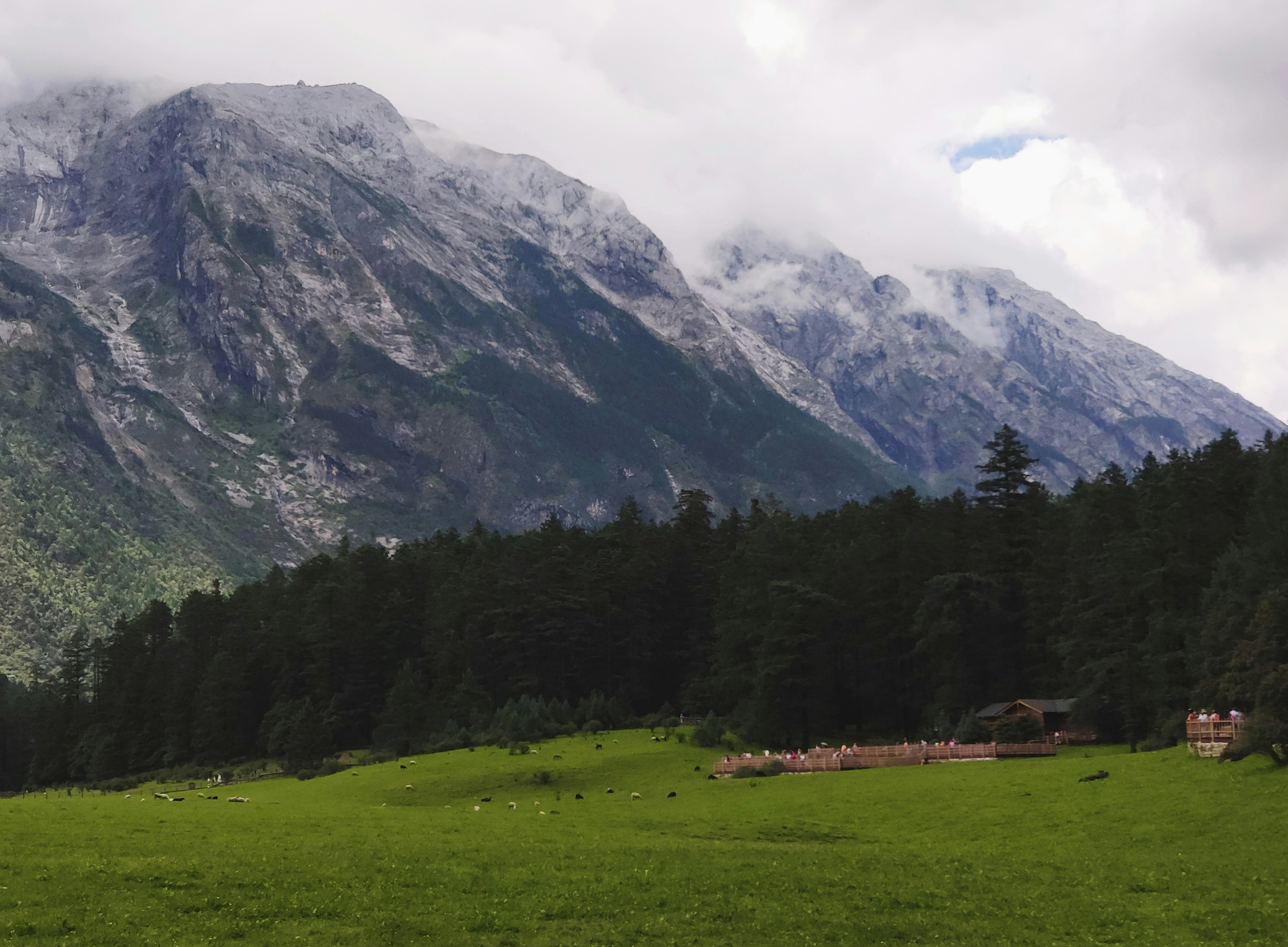 Pastoral Valleys Beneath Rugged Peaks