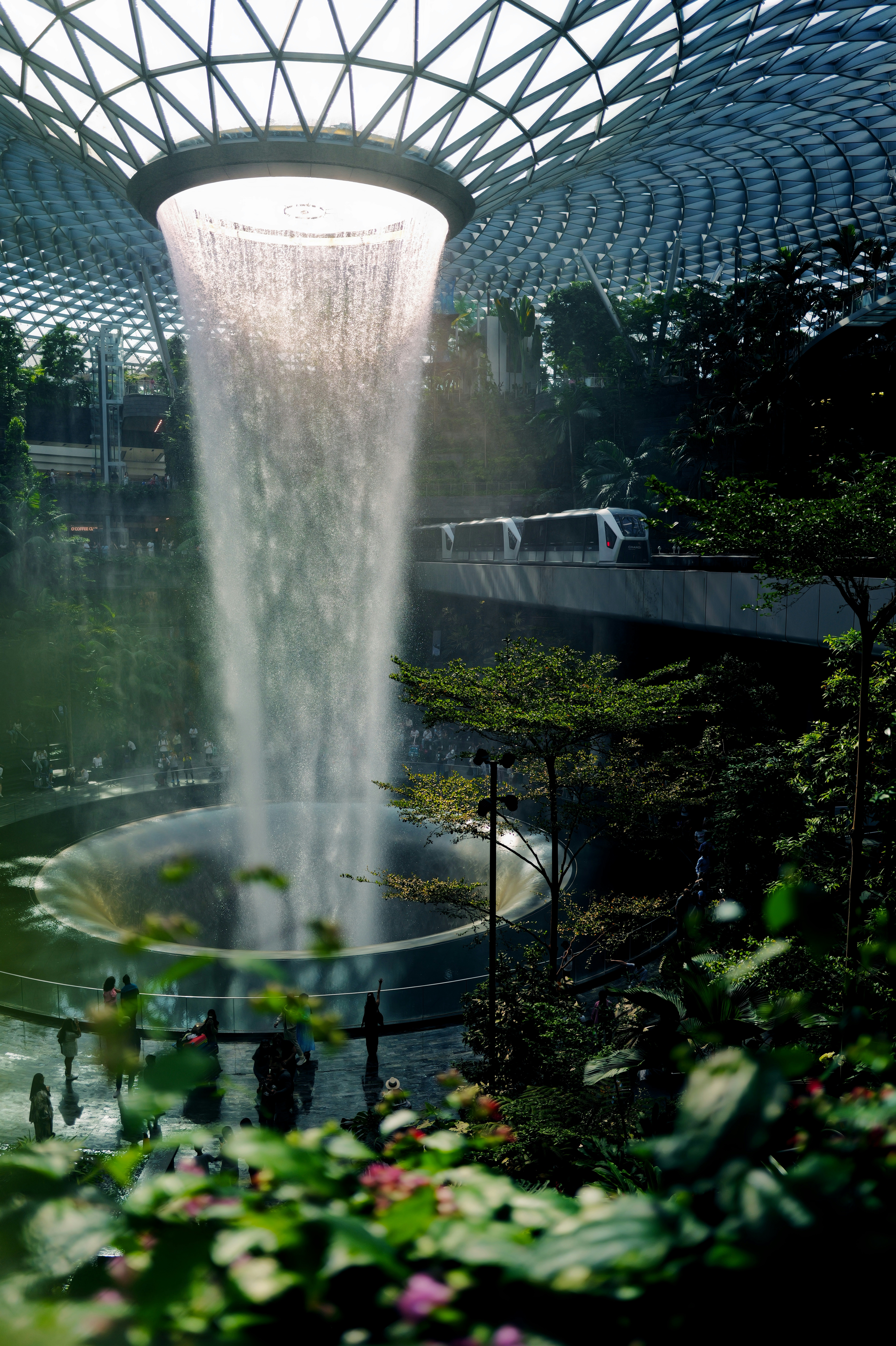 Circular Cascade Under a Geometric Glass Canopy