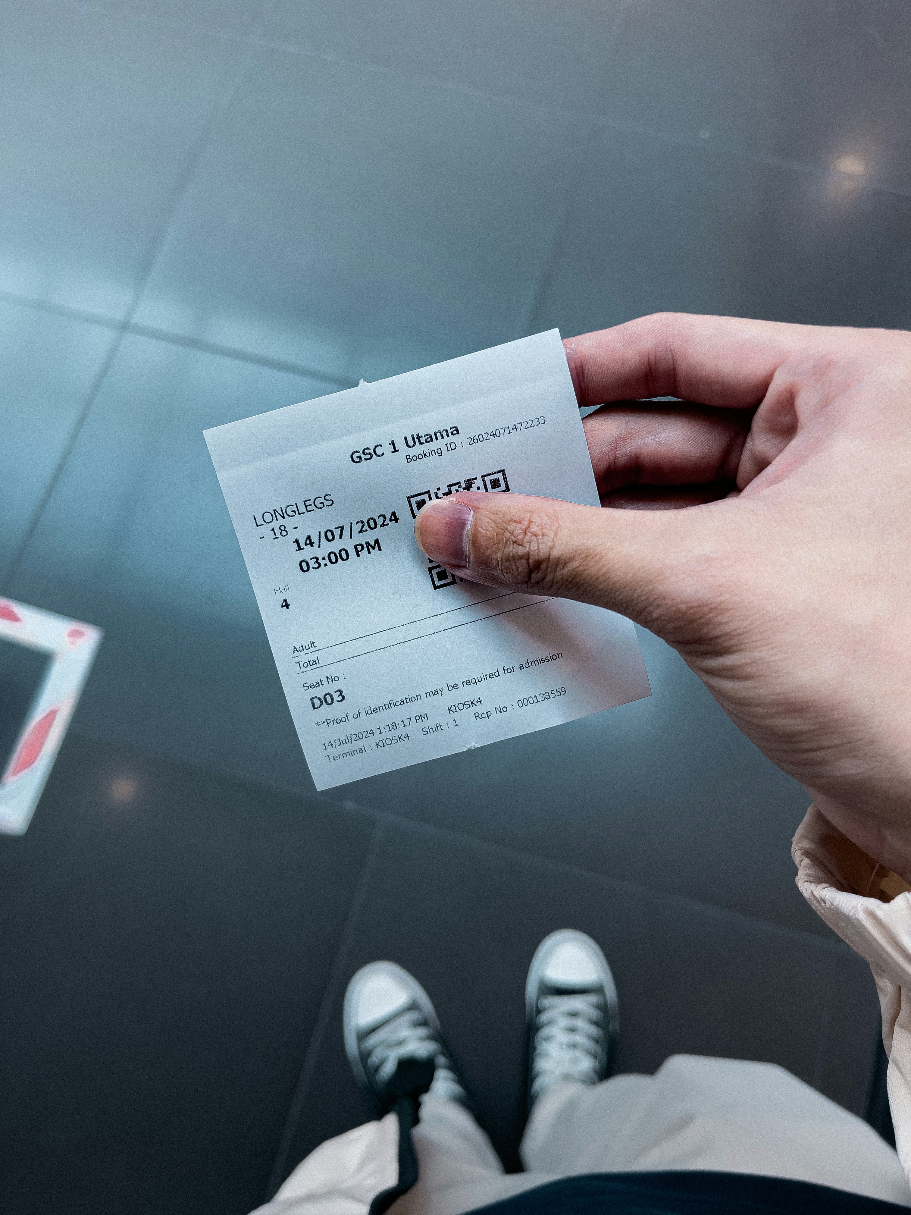 A person holding a ticket in their hand photo – Free Paper Image on ...