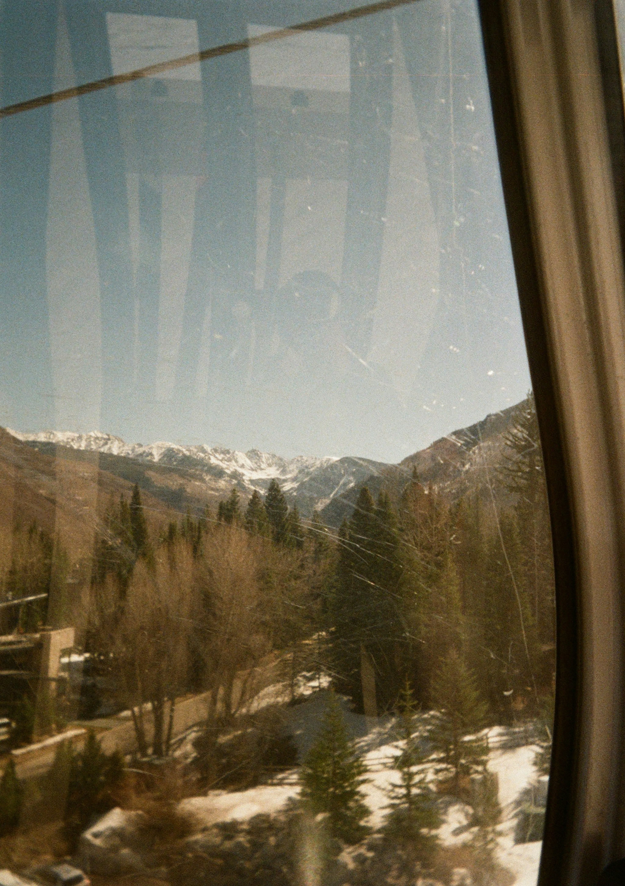 A view of a snowy mountain from a train window photo – Free Vail Image ...