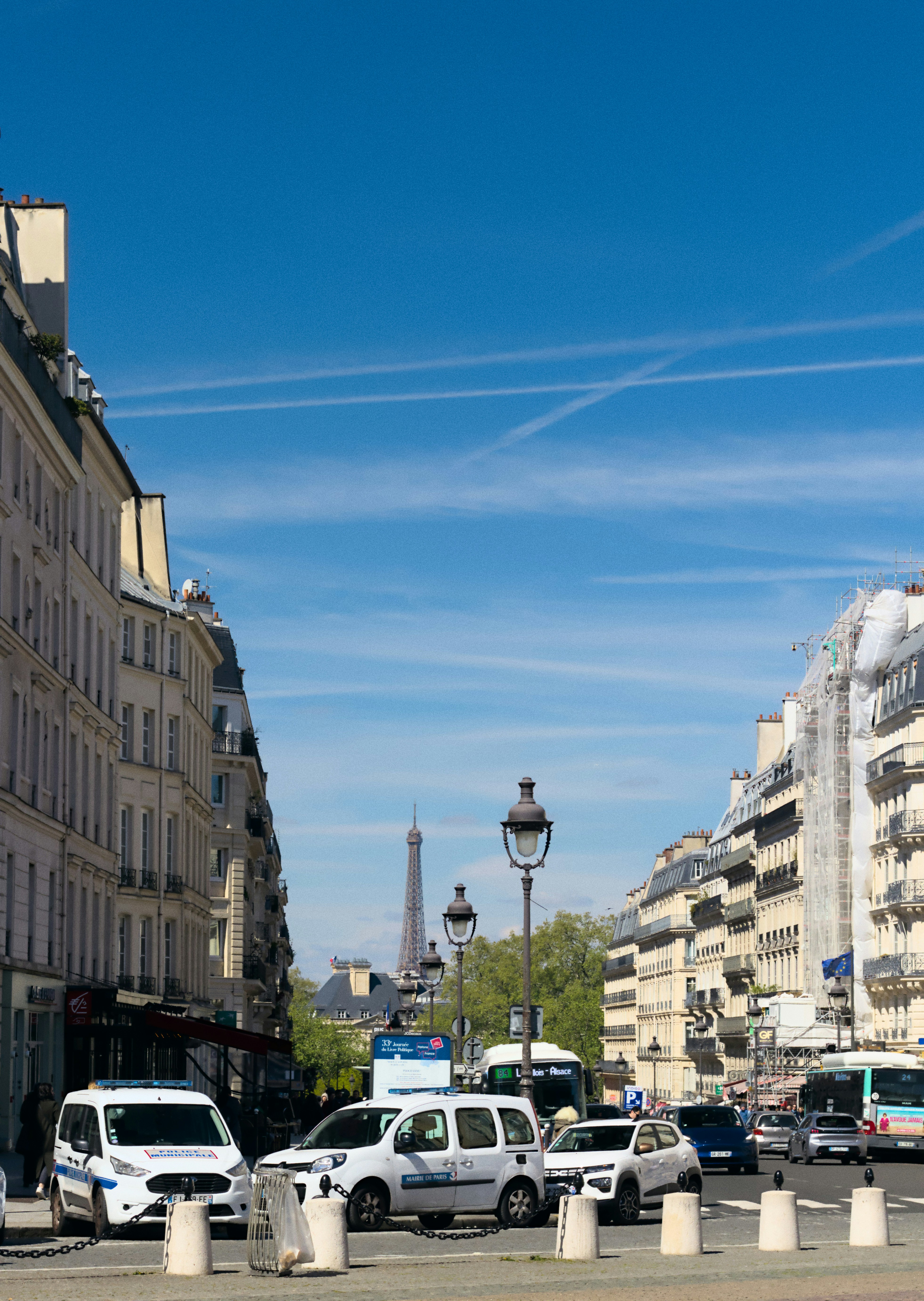 Eiffel in the Distance: Parisian Boulevard Framed by Haussmann Facades