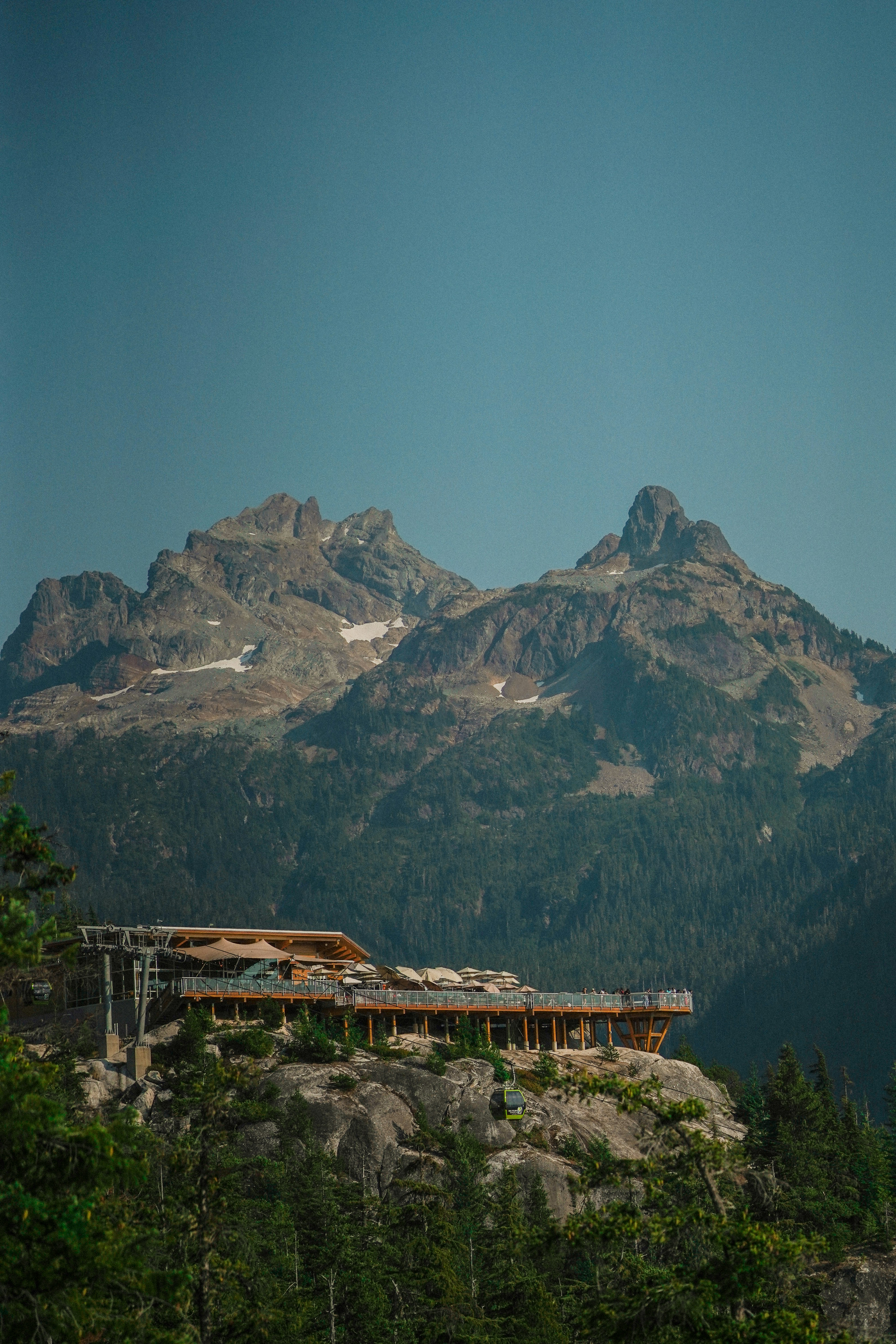 A mountain with a building on top of it photo – Free Forest Image on ...