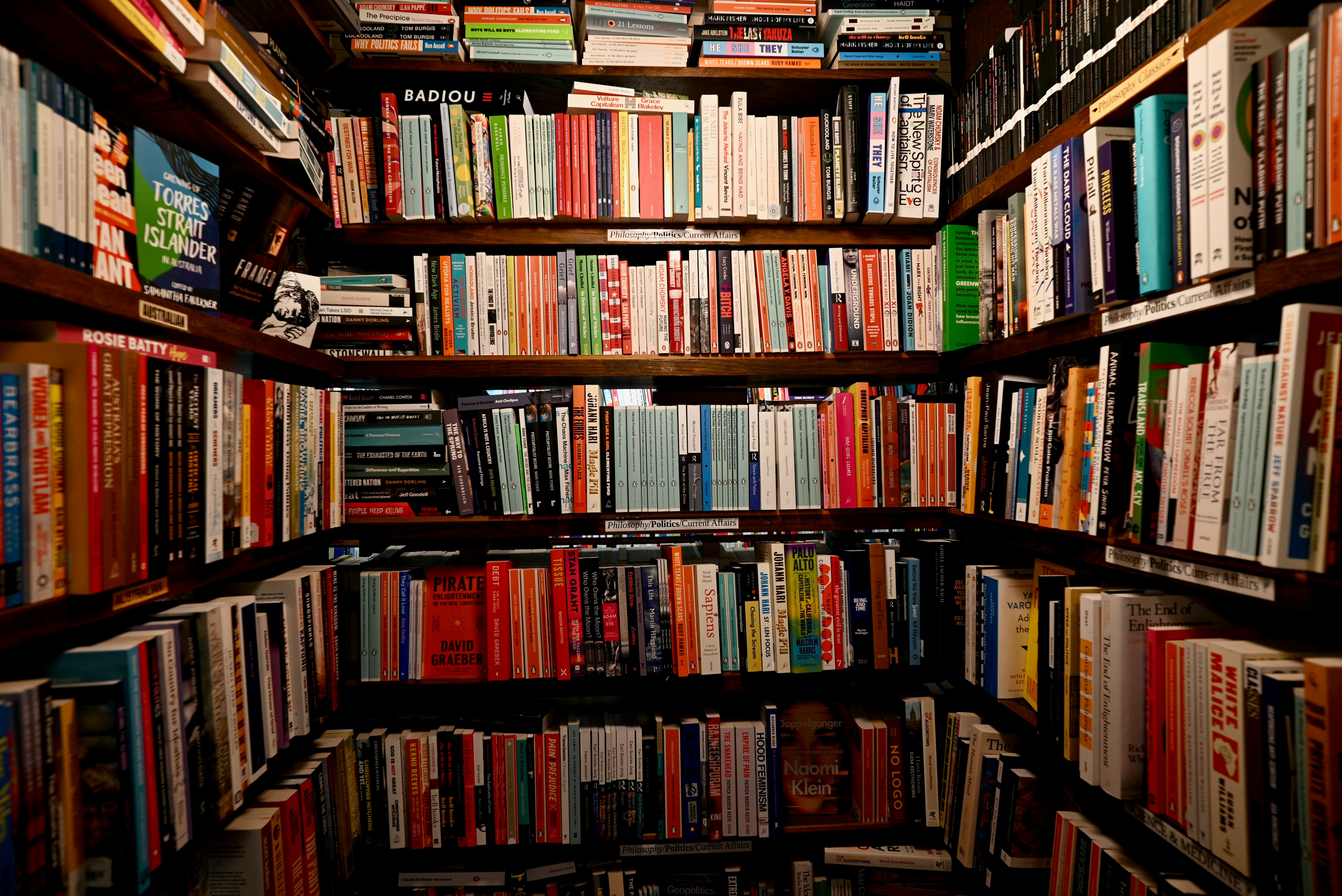 A bookshelf filled with lots of books in a library photo – Free ...