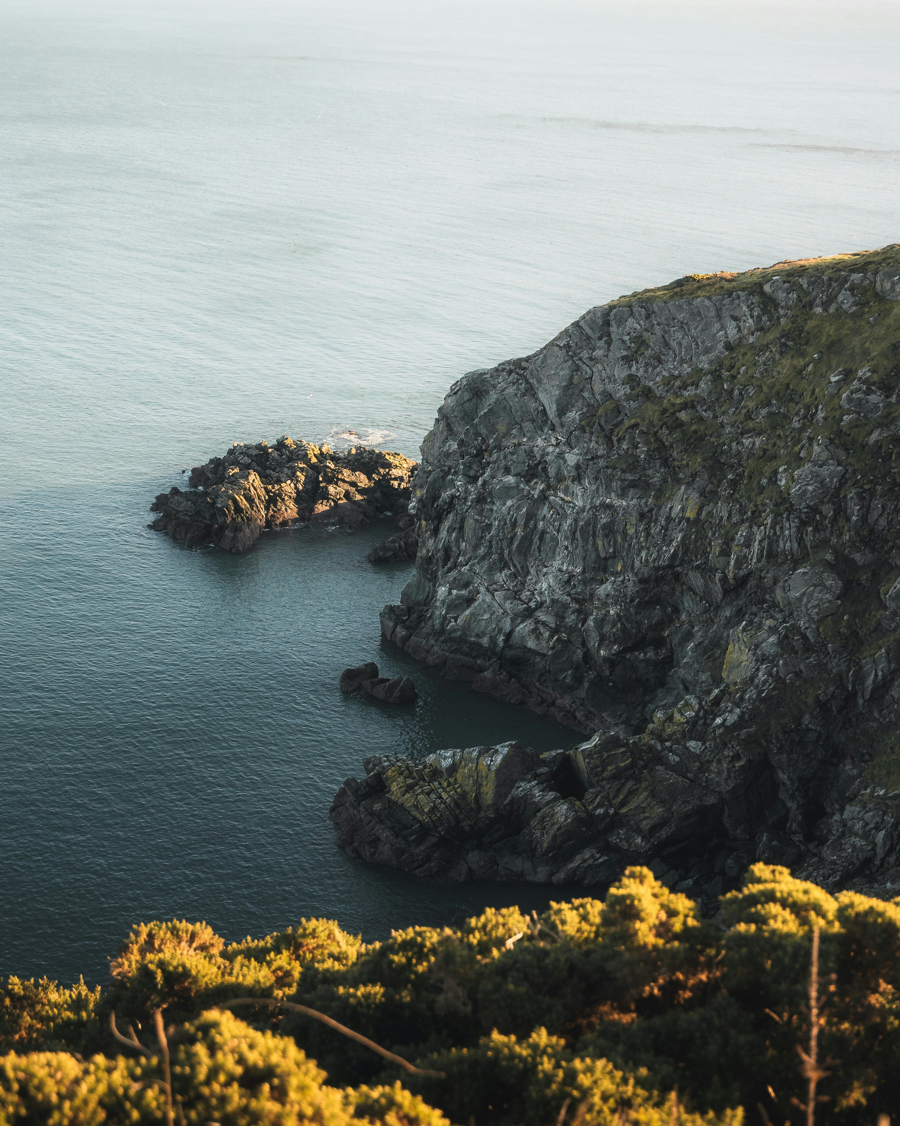 A view of a body of water near a cliff photo – Free Nature Image on ...