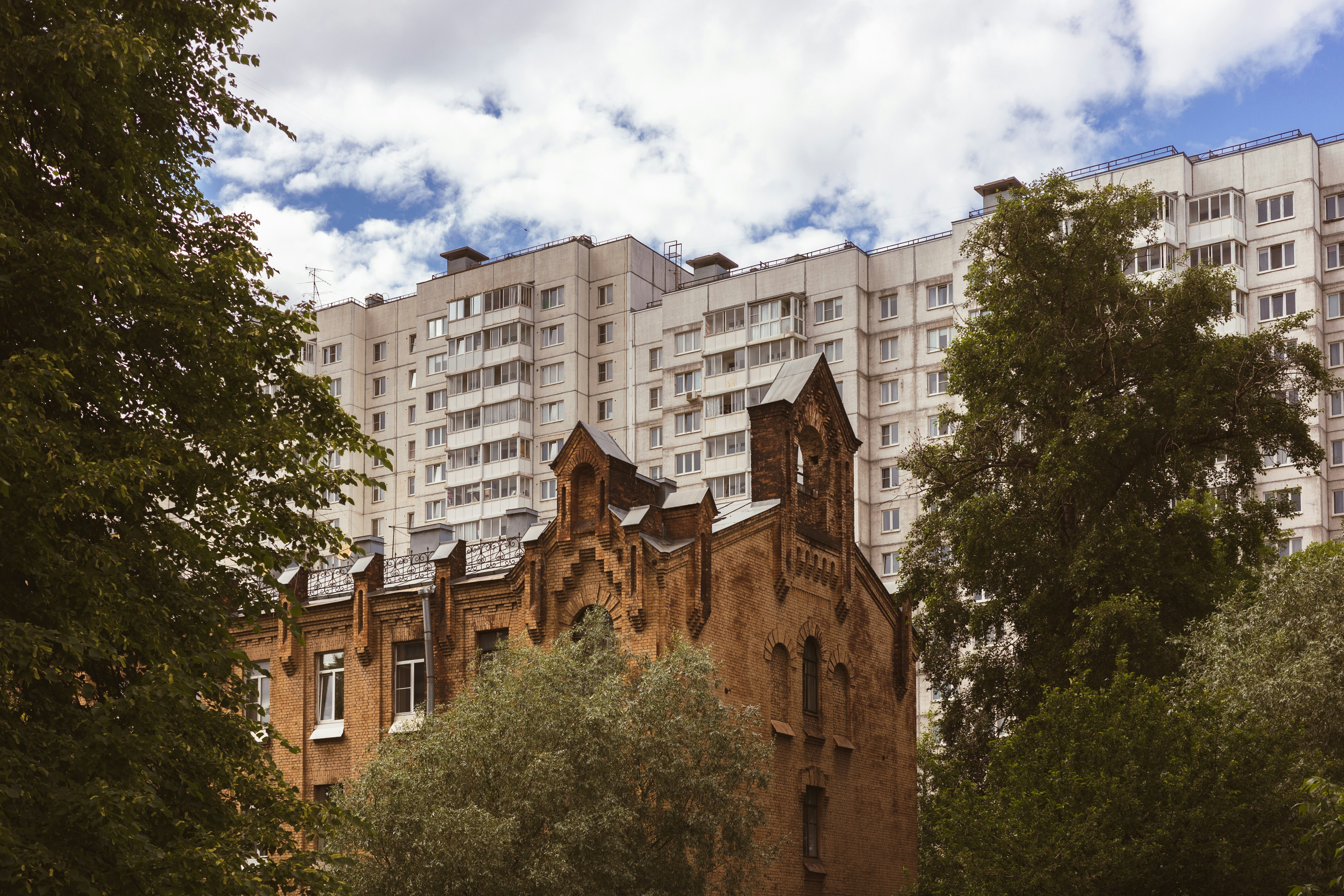 Brick Gothic Facade Tucked Between Modern High-Rises