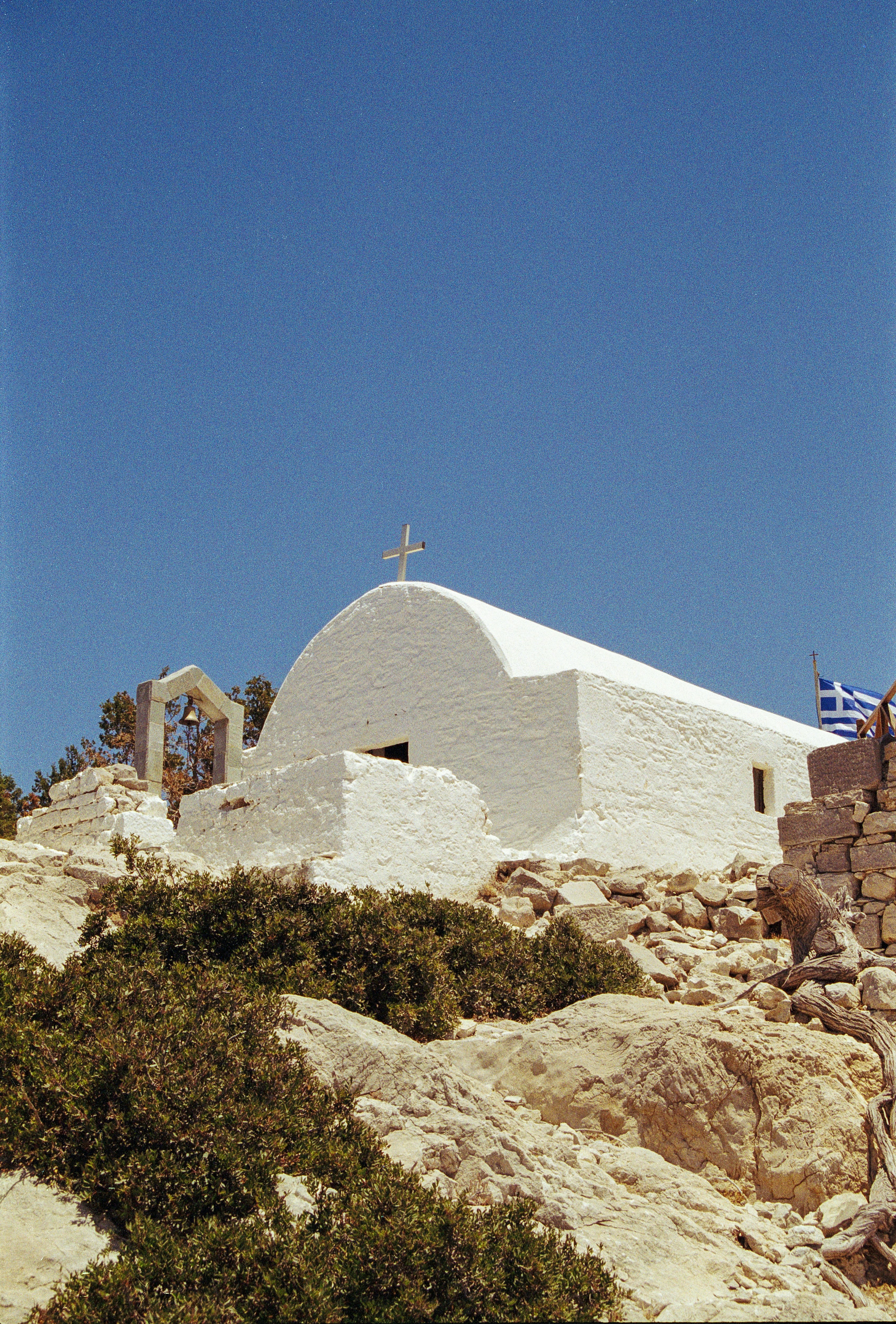 Cerulean Sky, Whitewashed Chapel: A Hilltop Cross