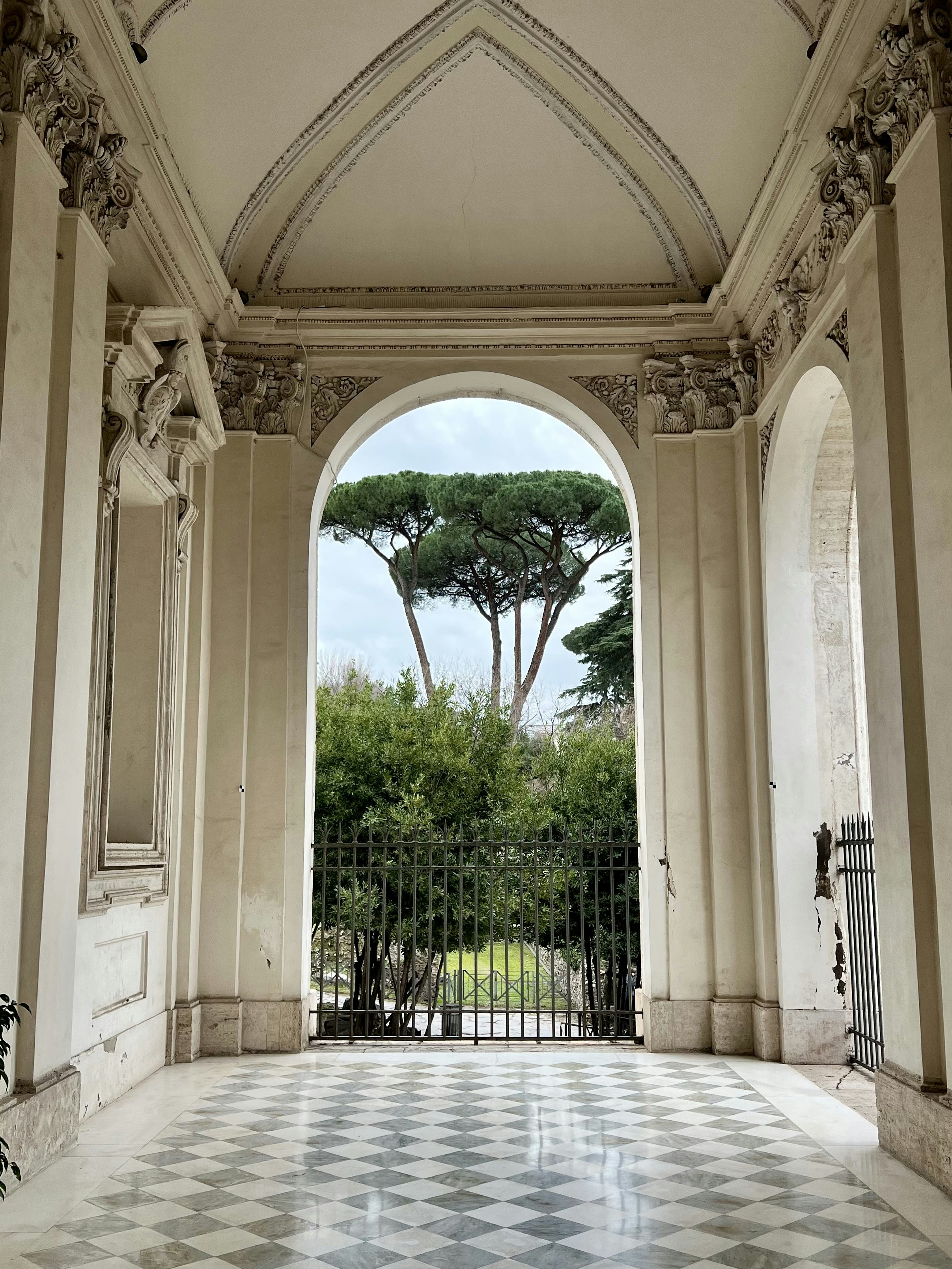 A large room with a checkered floor and arches photo – Free Rome Image ...