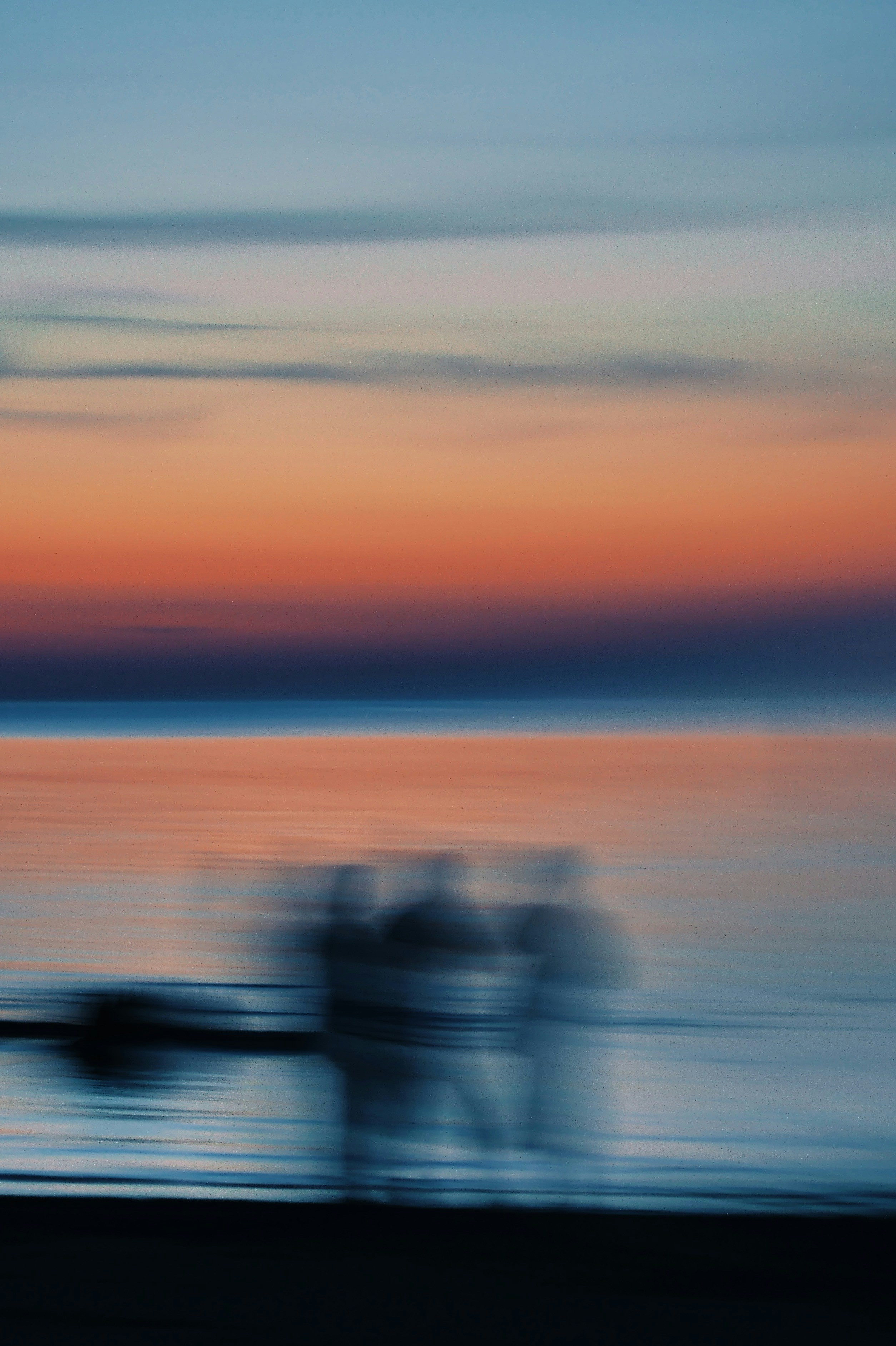 A blurry photo of a beach at sunset photo – Free Baltic sea Image on ...