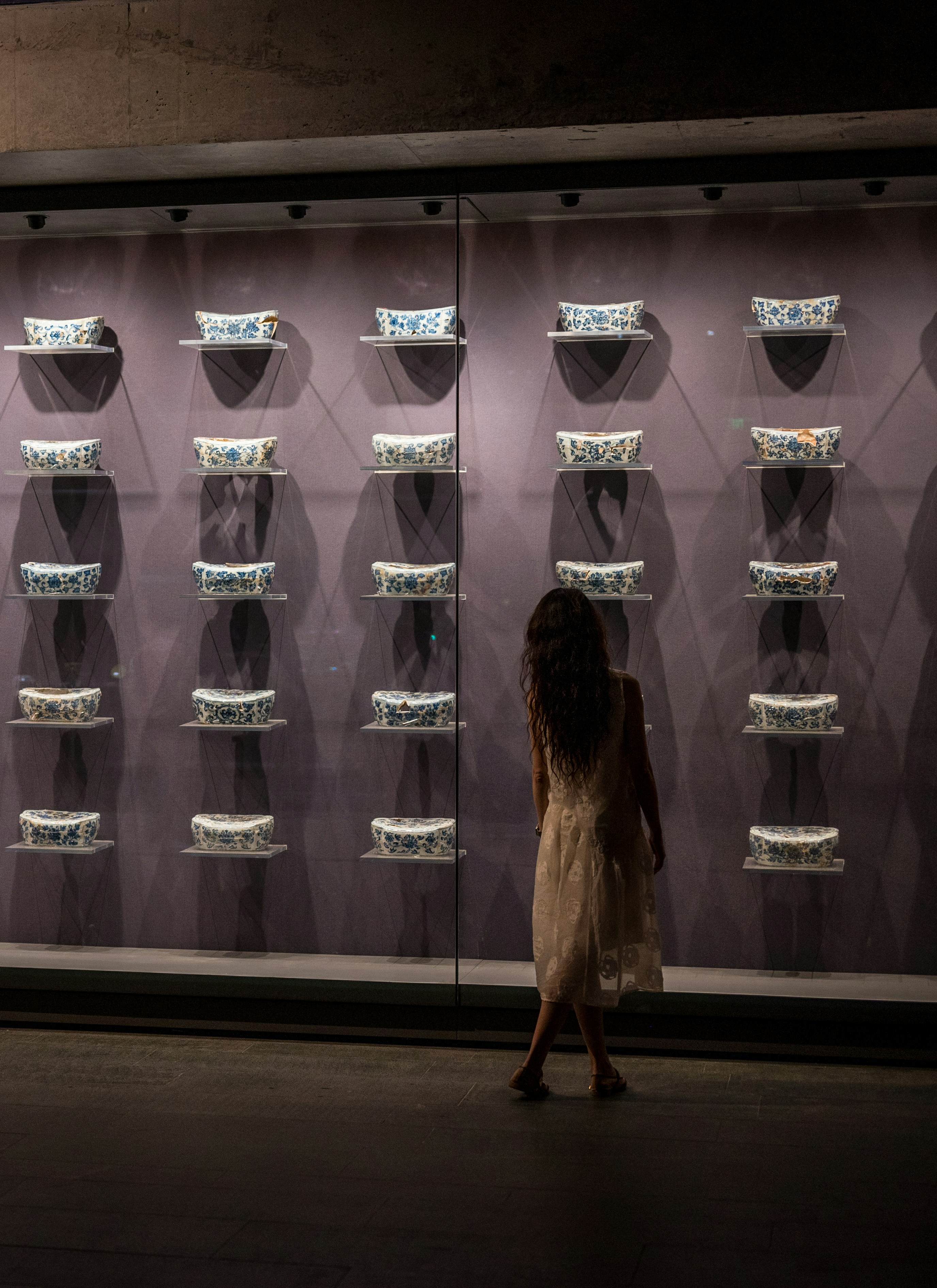 Silent Gaze Among Porcelain Ornaments