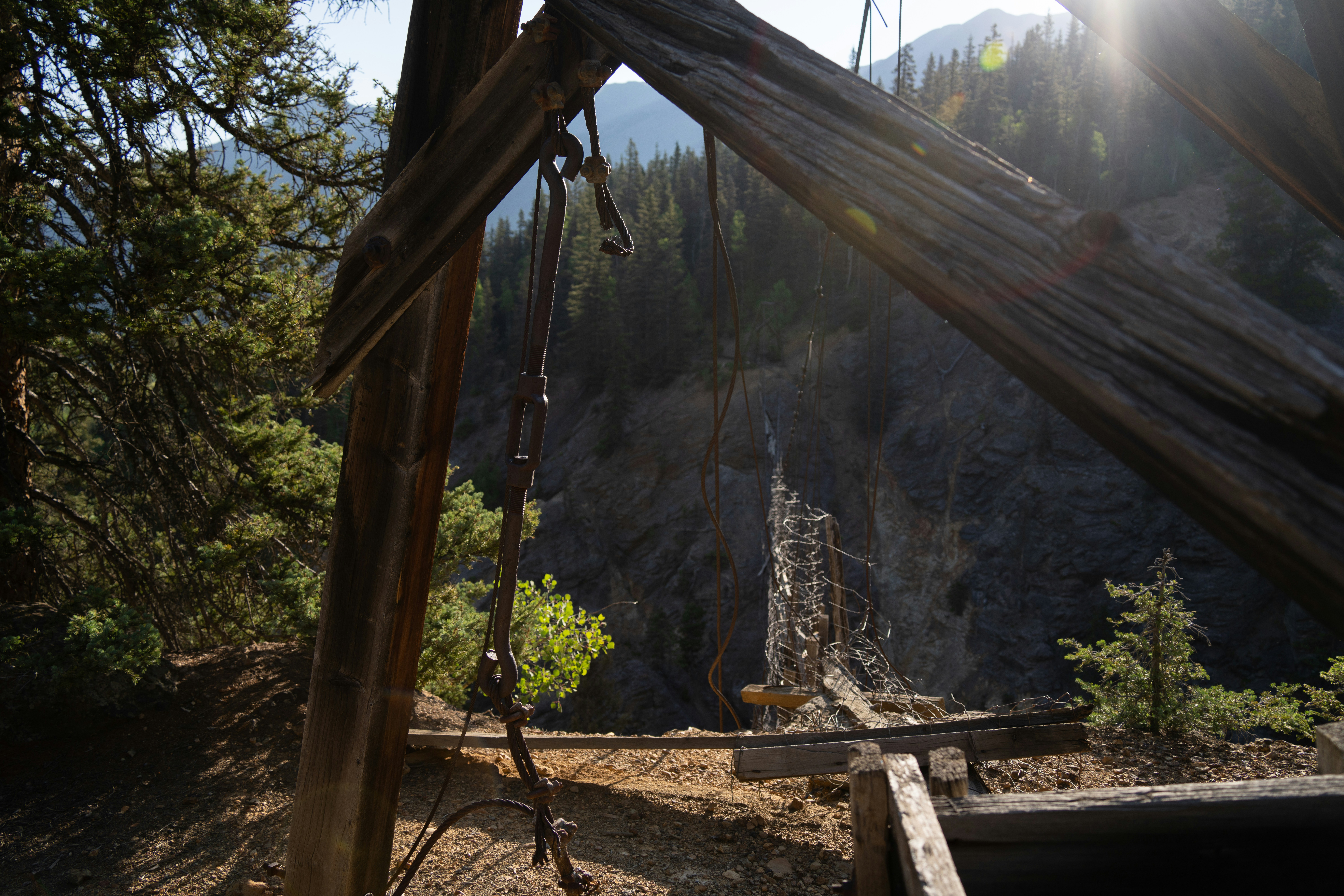 Sunlit Timber Frame Over a Shadowed Gorge